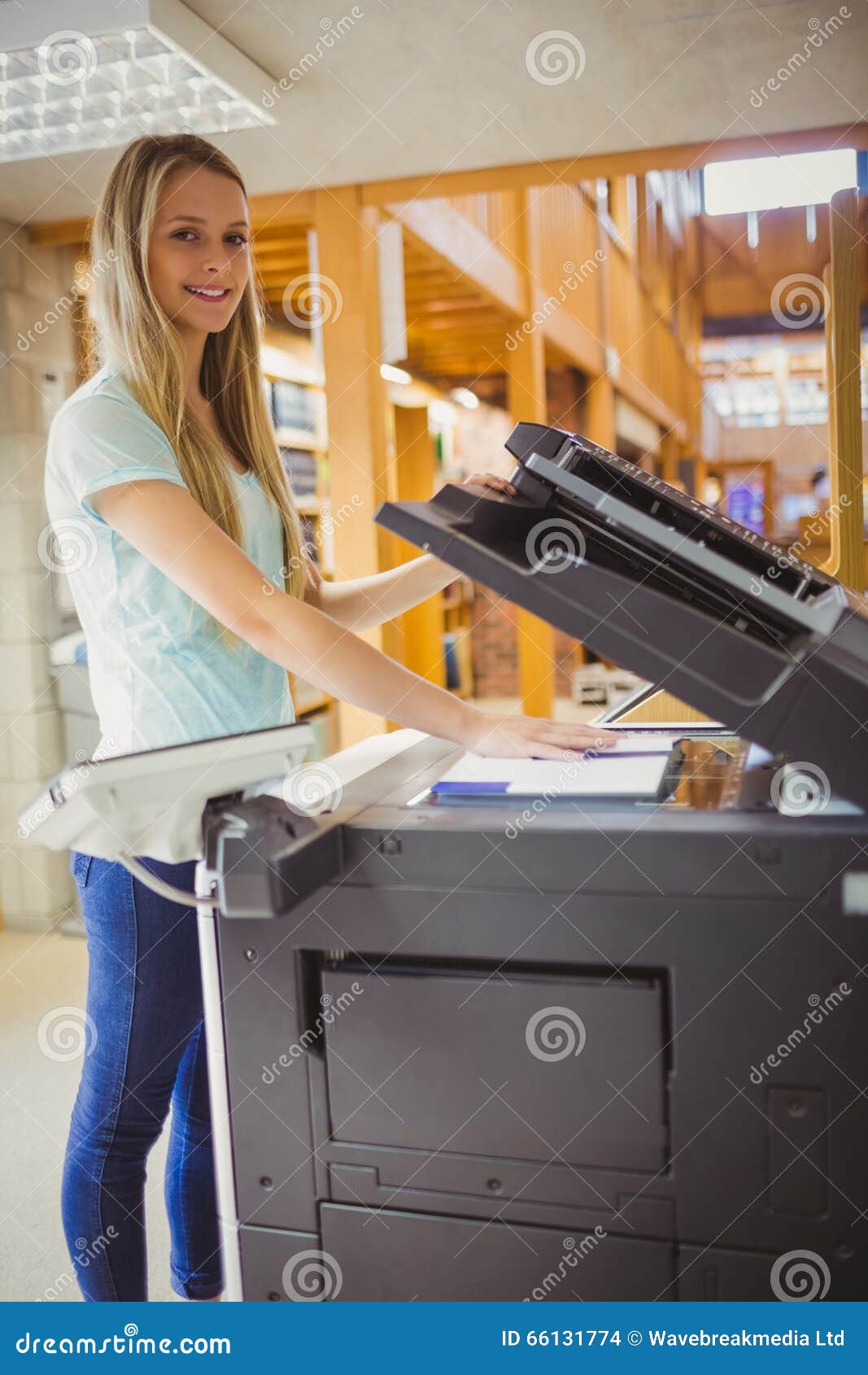 Smiling Blonde Student Making a Copy Stock Photo - Image of ...