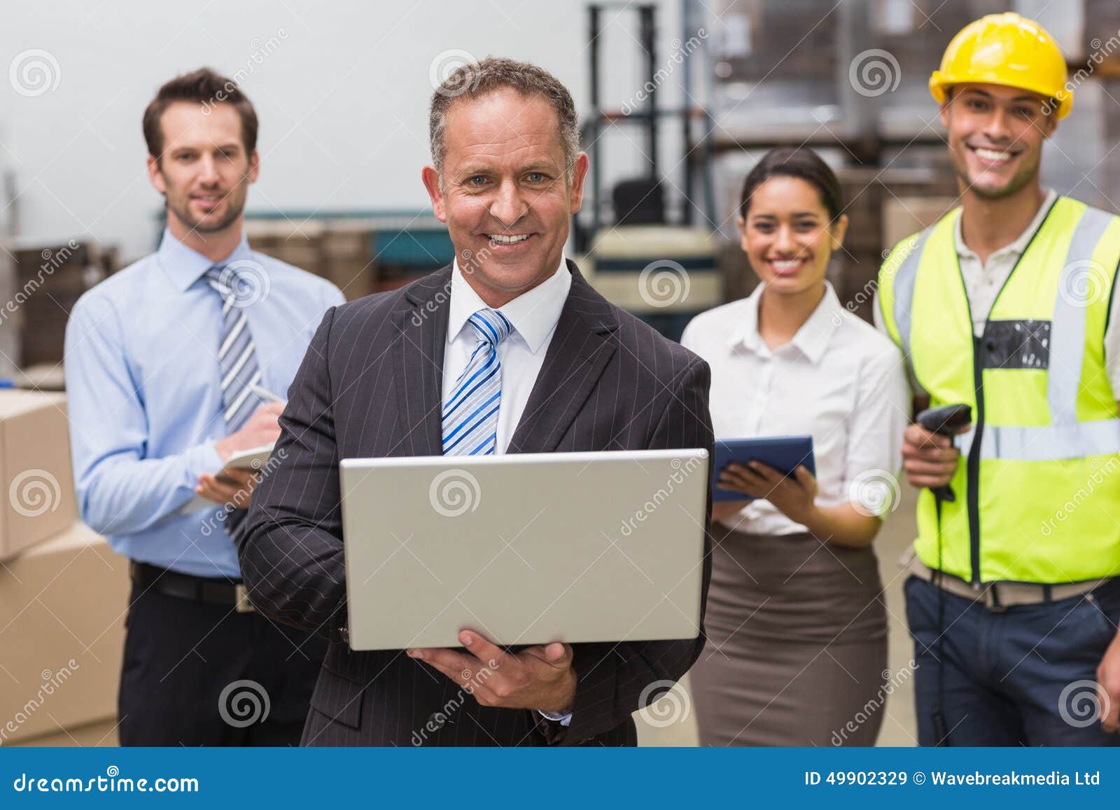 Smiling Boss Using Laptop in Front of His Employees Stock Image - Image ...
