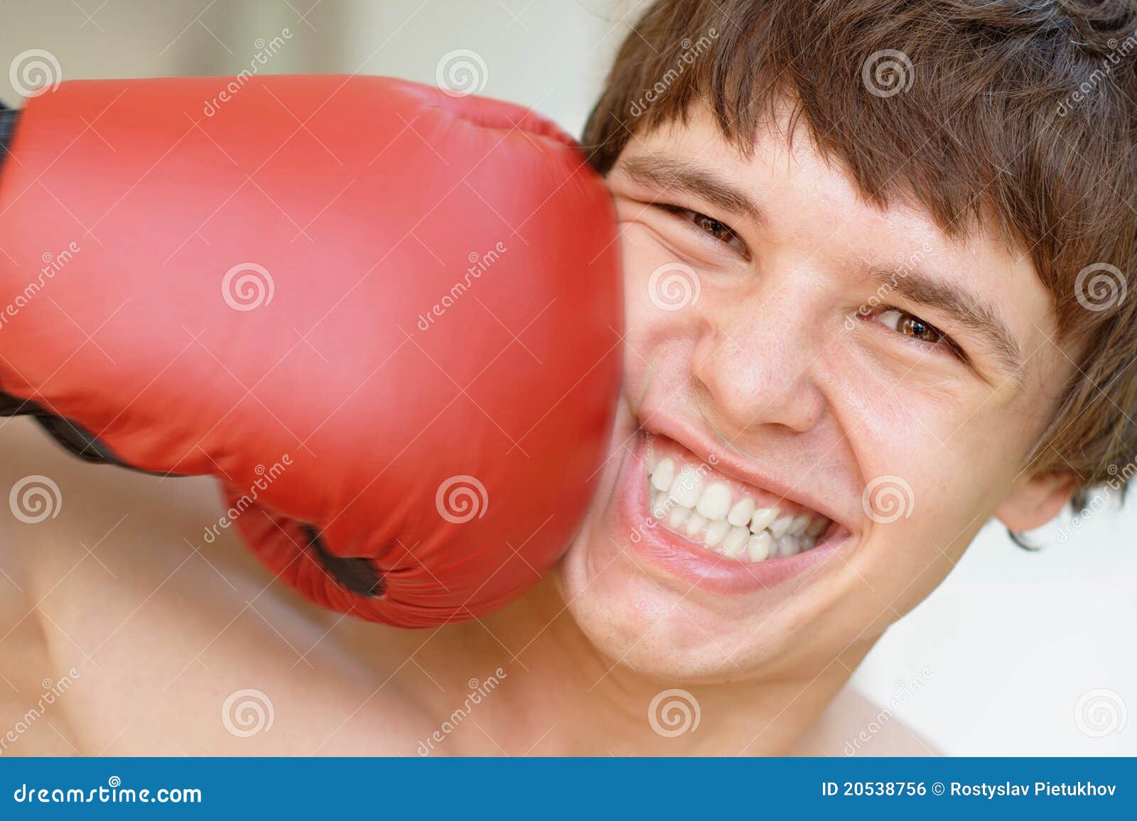 Smiling boxer gets a punch stock photo. Image of attack - 20538756