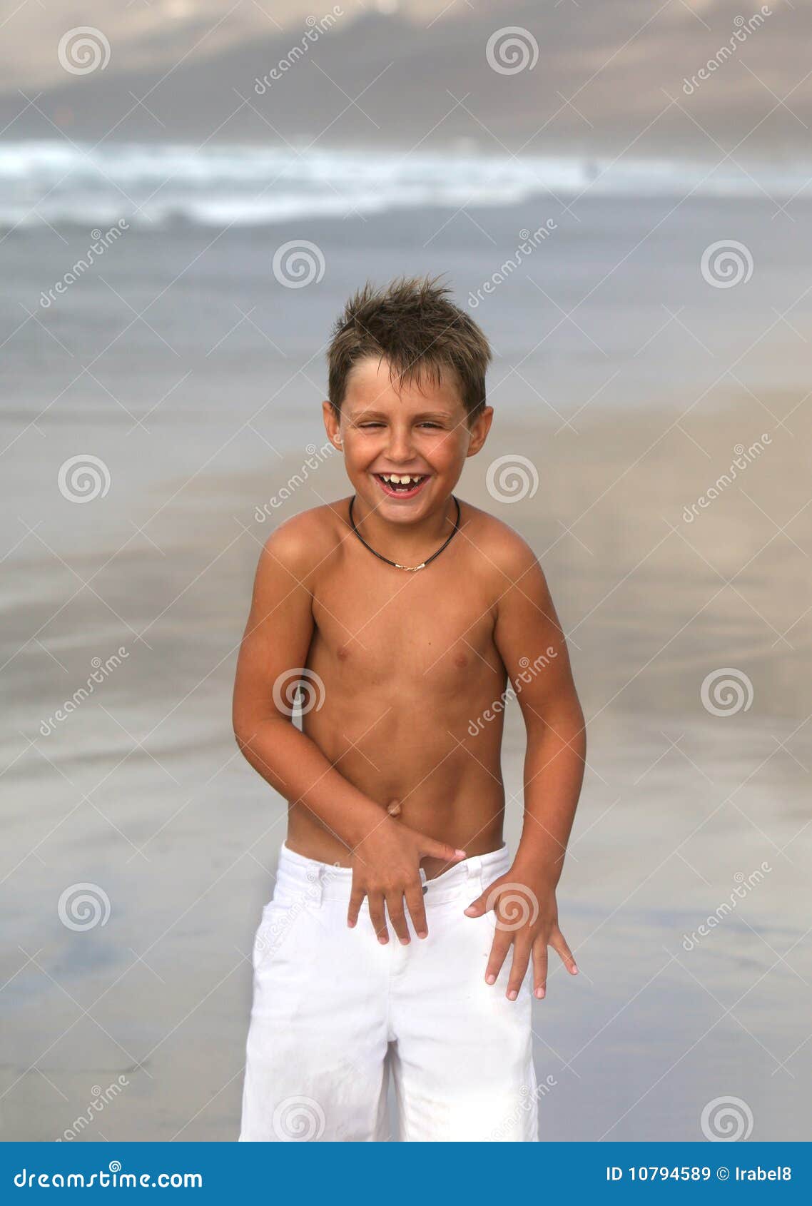 Smiling boy on the beach stock image. Image of mouth - 10794589
