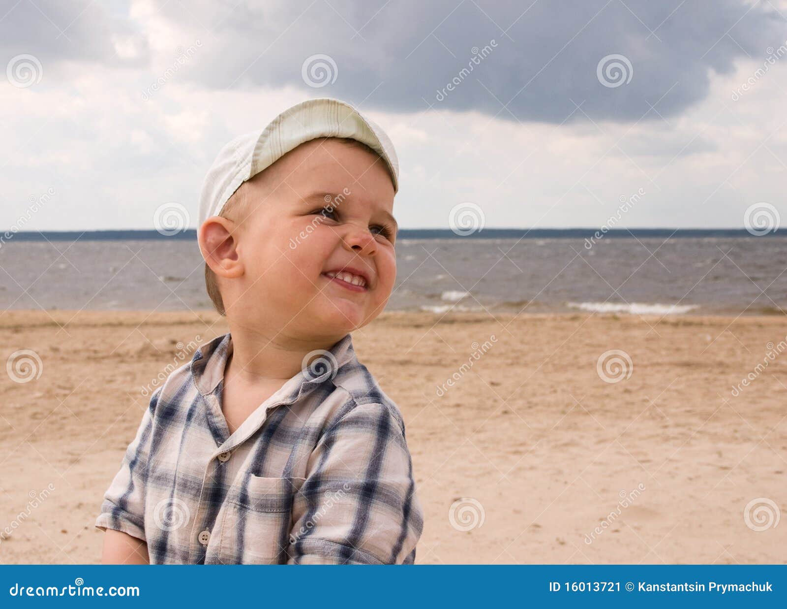 Smiling boy on a beach stock image. Image of playful - 16013721