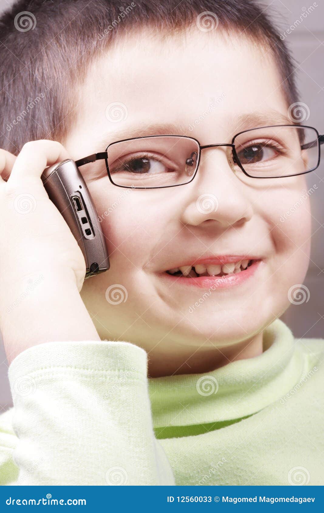 Smiling Boy with Cell Phone Stock Image - Image of eyes, vertical: 12560033