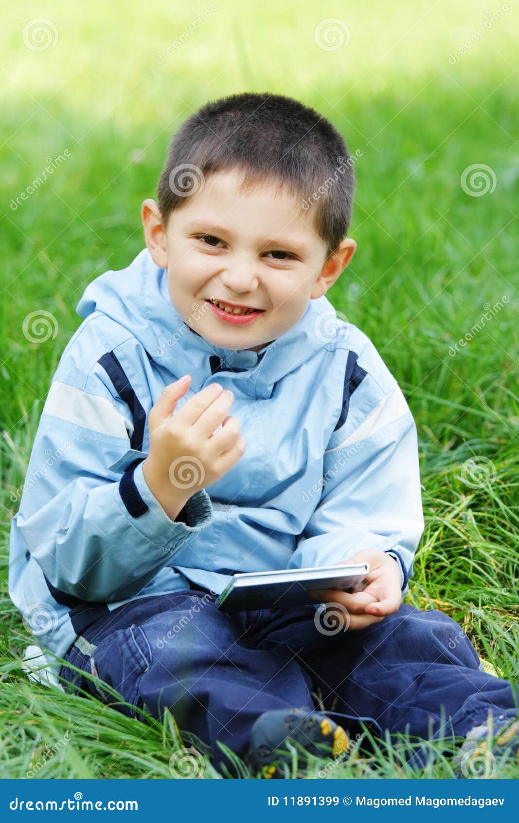 Smiling Boy with Closed Book Stock Image - Image of caucasian, vertical ...