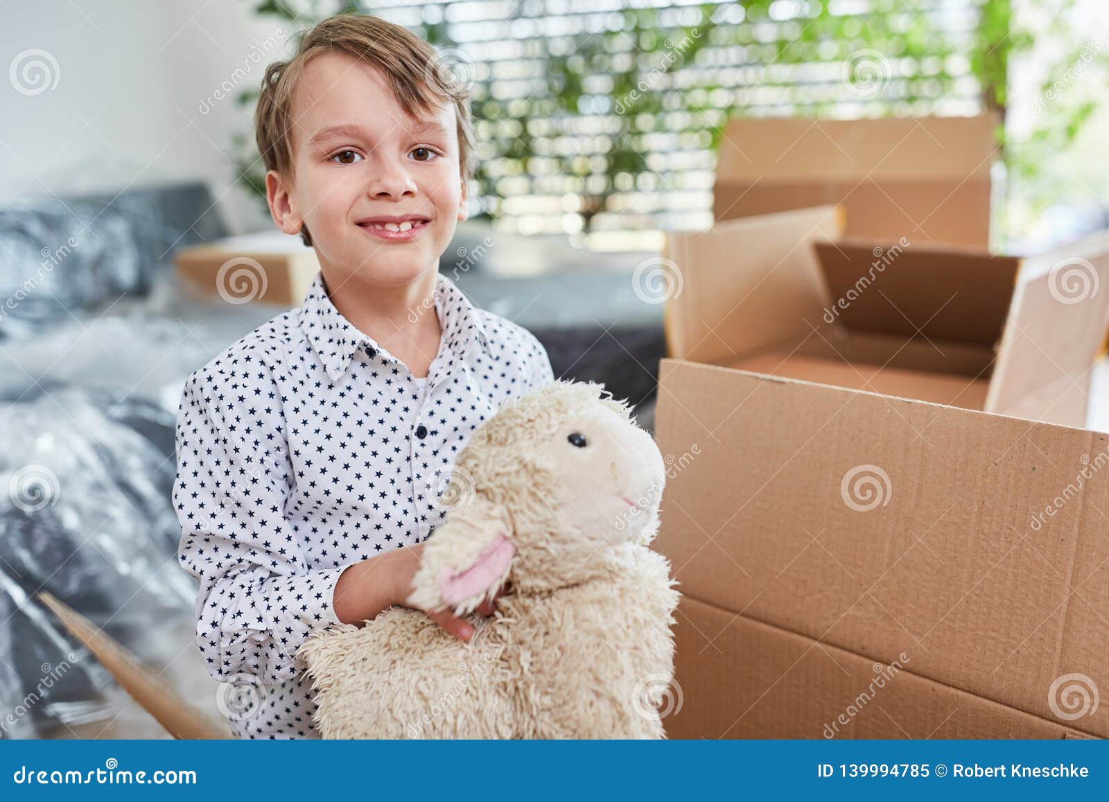 Smiling Boy with Cuddly Toy while Moving Stock Image - Image of pack ...