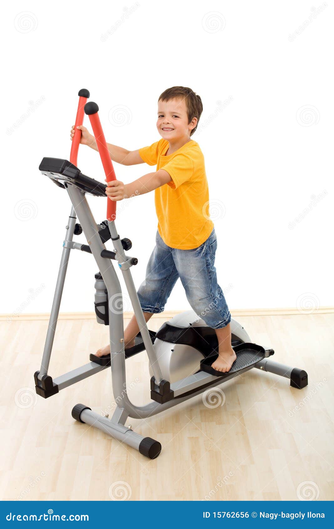 Smiling Boy on Elliptical Trainer in the Gym Stock Photo - Image of ...