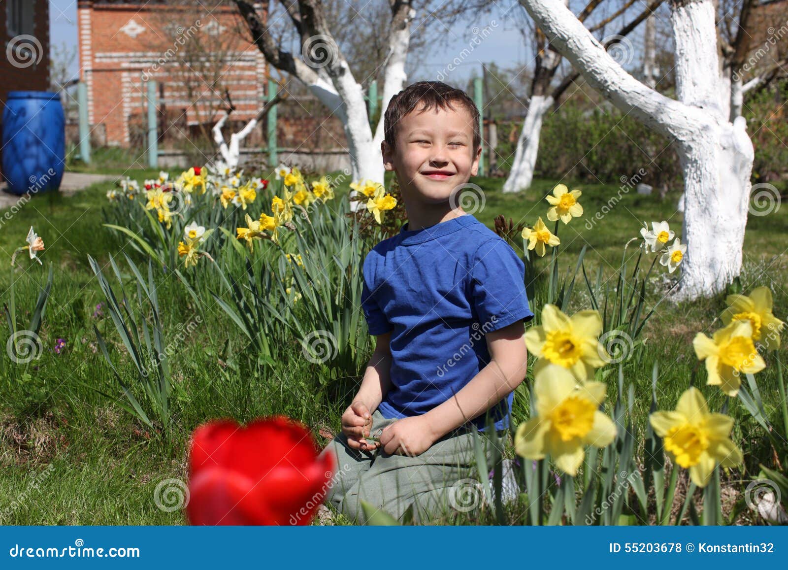 Smiling boy at flowers stock photo. Image of smell, emotions - 55203678