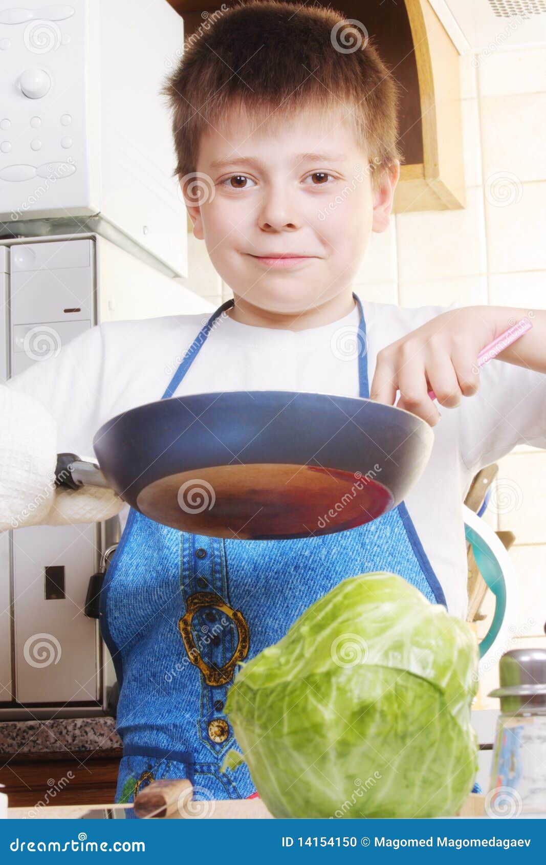 Smiling Boy with Frying-pan Stock Photo - Image of apron, cute: 14154150