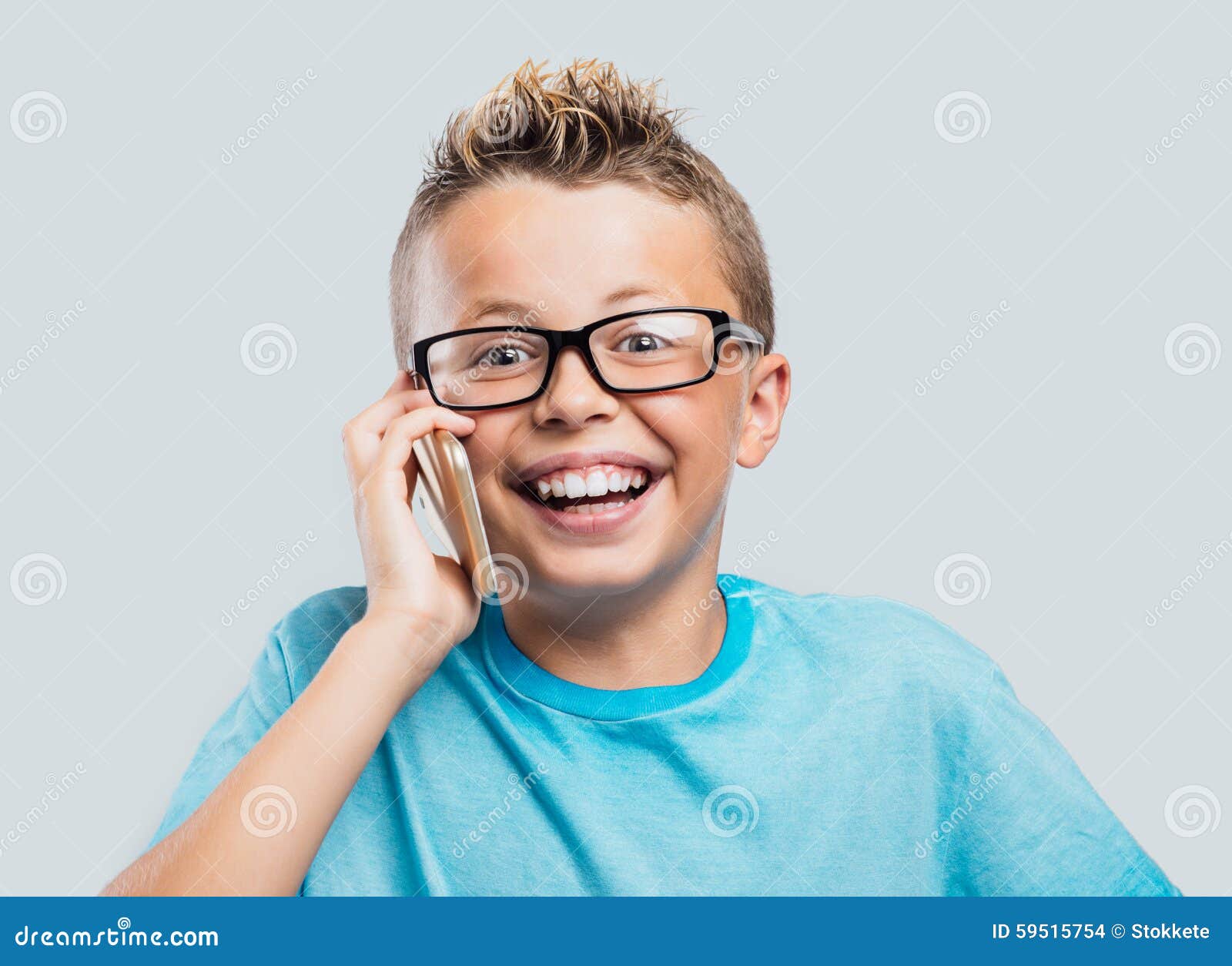 Smiling Boy Having a Phone Call Stock Photo - Image of screen, glasses ...