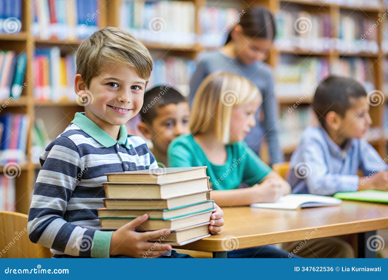 Smiling Boy Holds Books in School Library with Classmates Stock ...
