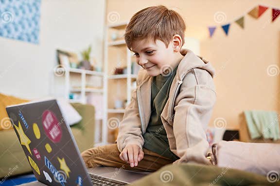 Smiling Boy Looking at Computer Screen Stock Image - Image of ...