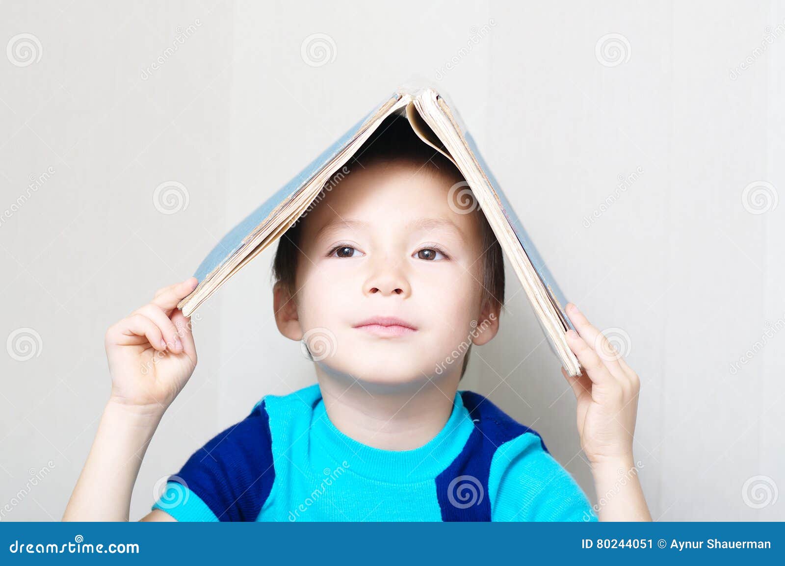 Smiling Boy Looking Forward Making Book Roof Stock Image - Image of ...