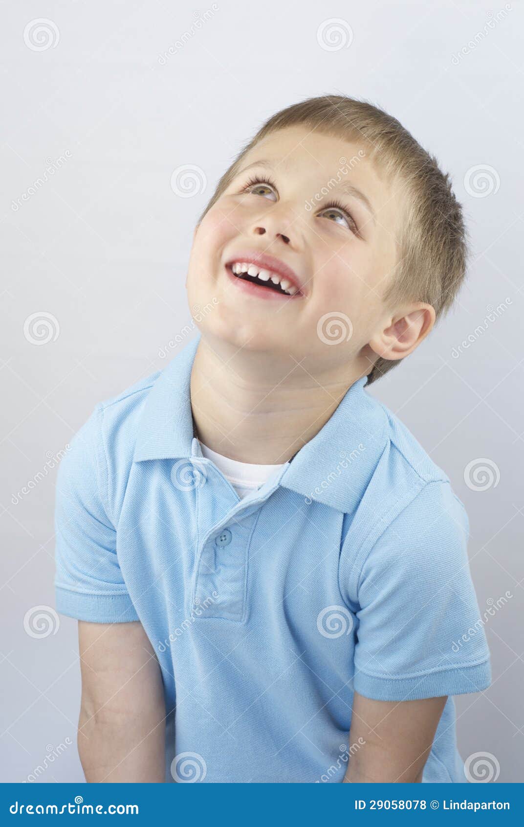 Smiling Boy Looking Up stock photo. Image of expressive - 29058078