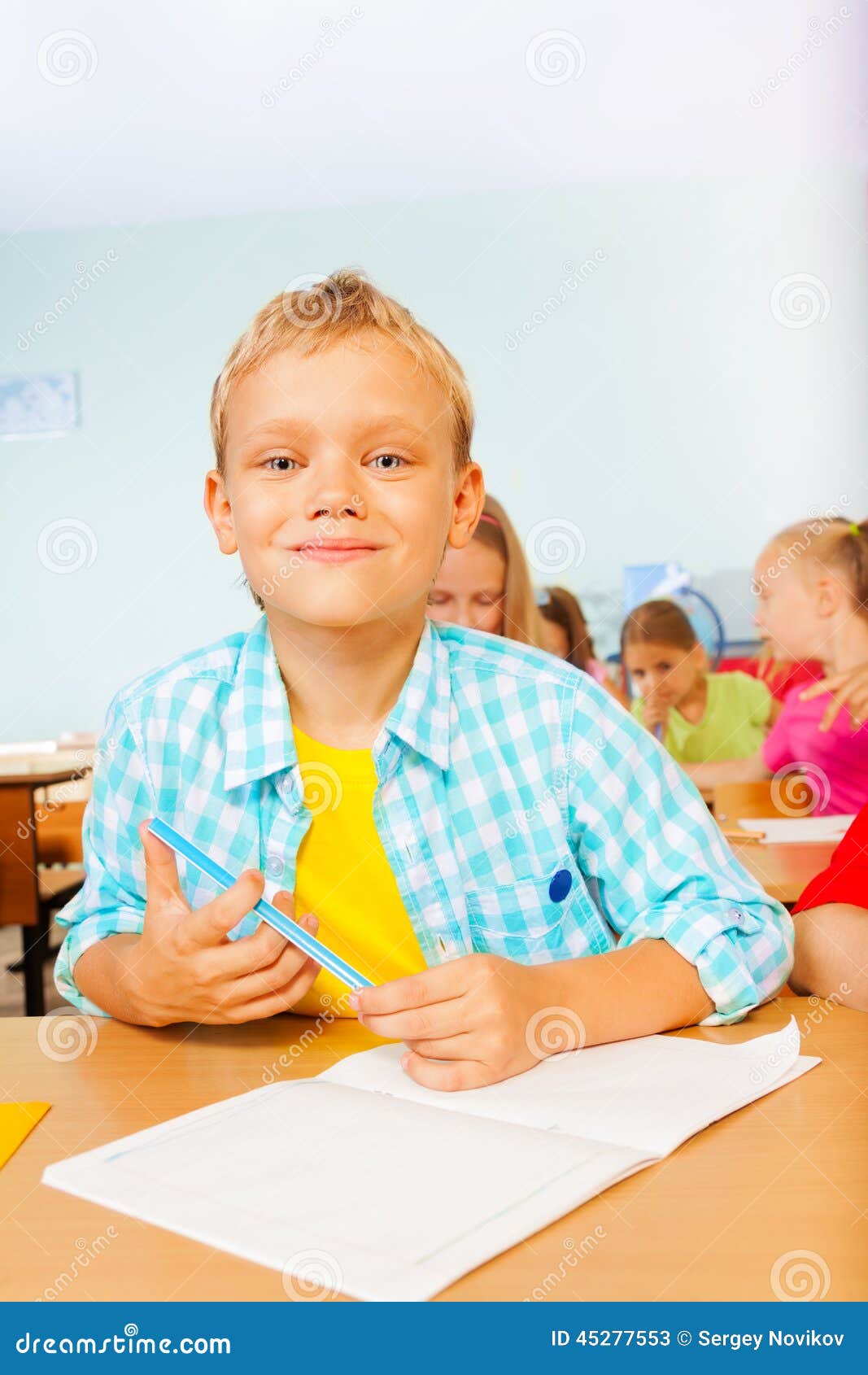 Smiling Boy Looks while Writing in Exercise Book Stock Image - Image of ...