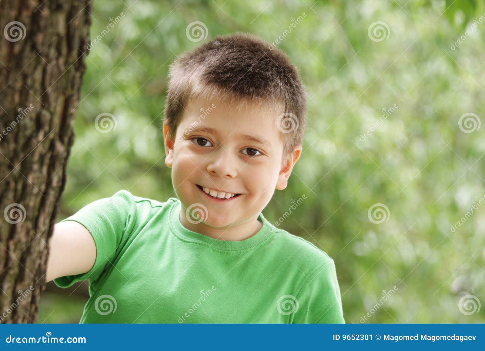 Smiling boy outdoor stock image. Image of male, green - 9652301