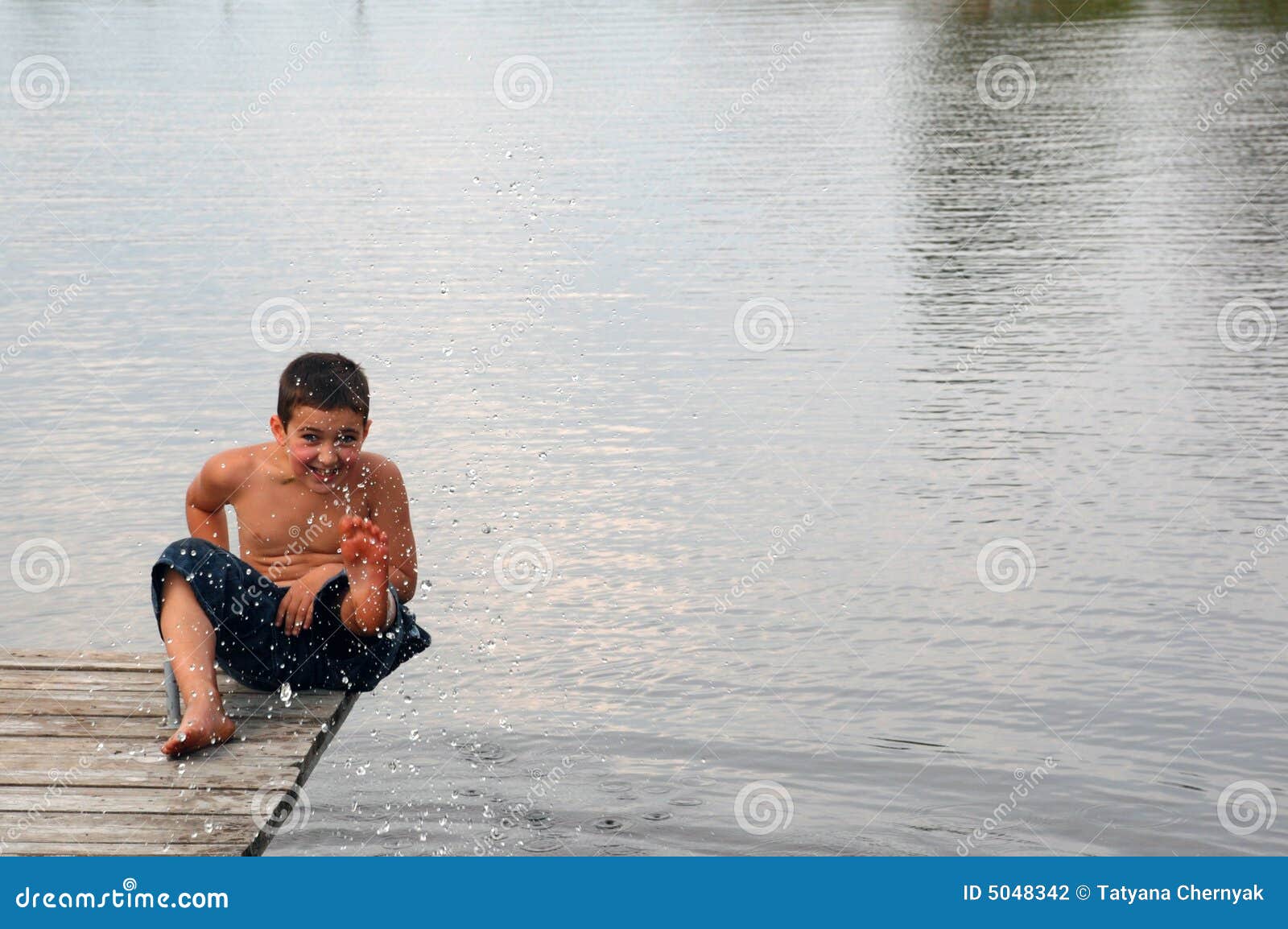 Smiling boy on the pier stock photo. Image of outdoors - 5048342