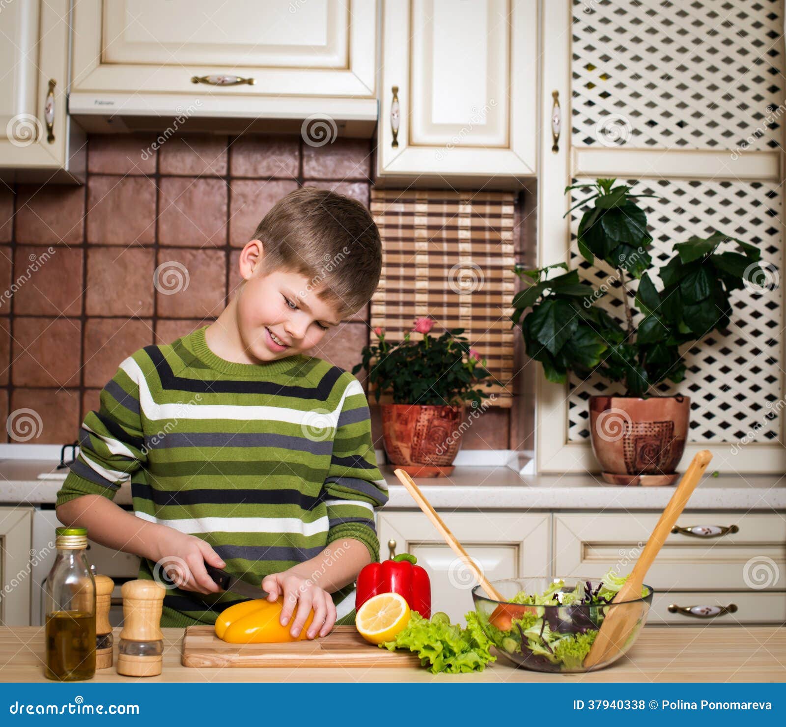 Smiling Boy Preparing a Salad in the Kitchen. Stock Photo - Image of ...