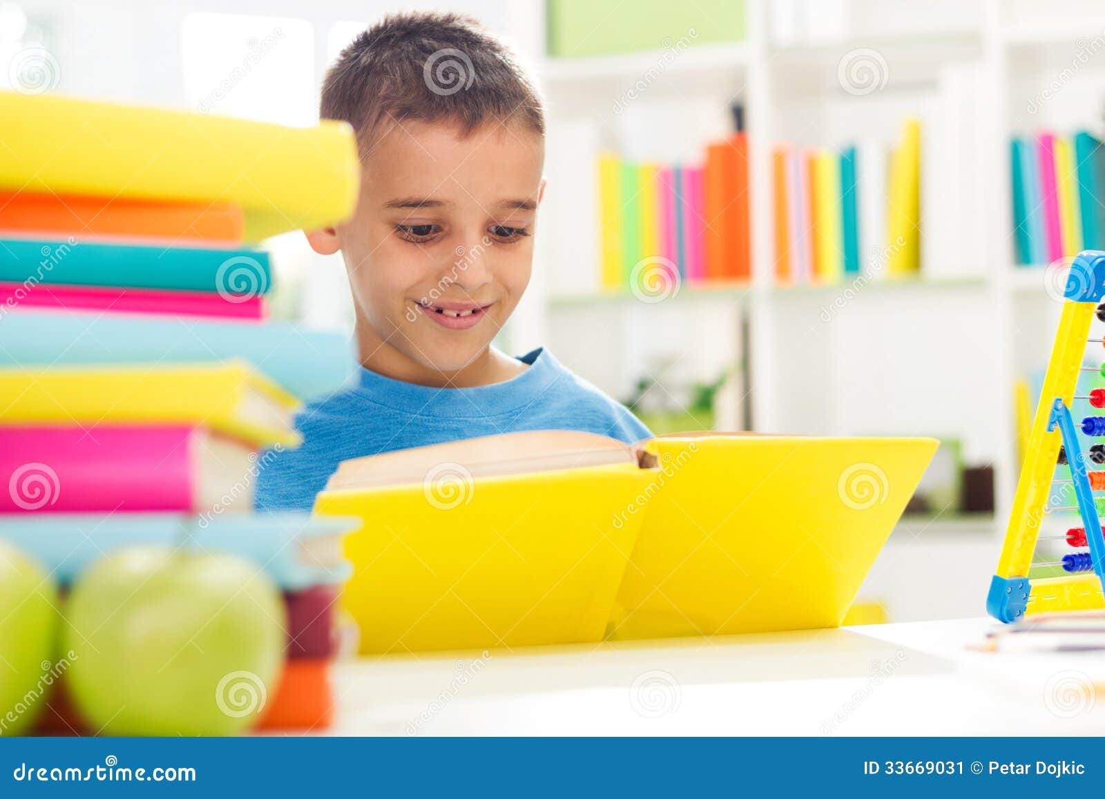 Smiling boy reading stock image. Image of happiness, bright - 33669031