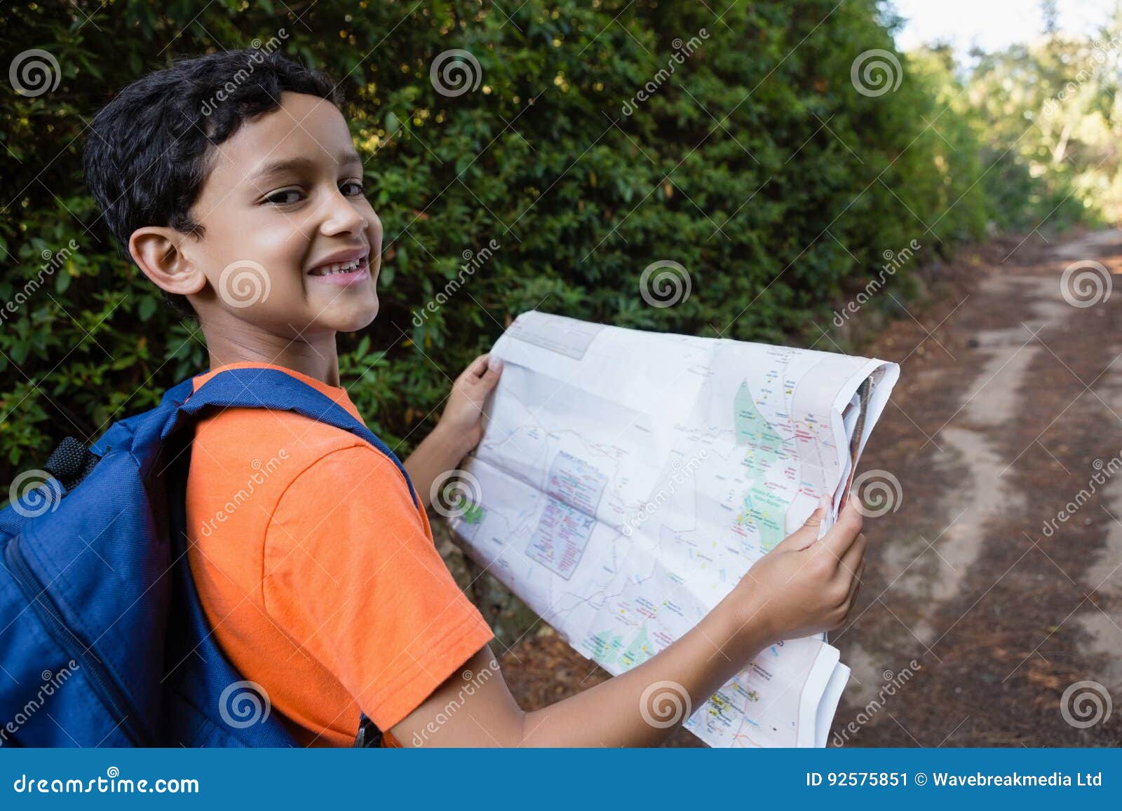 Smiling Boy Reading the Map while Walking on the Path Stock Image ...