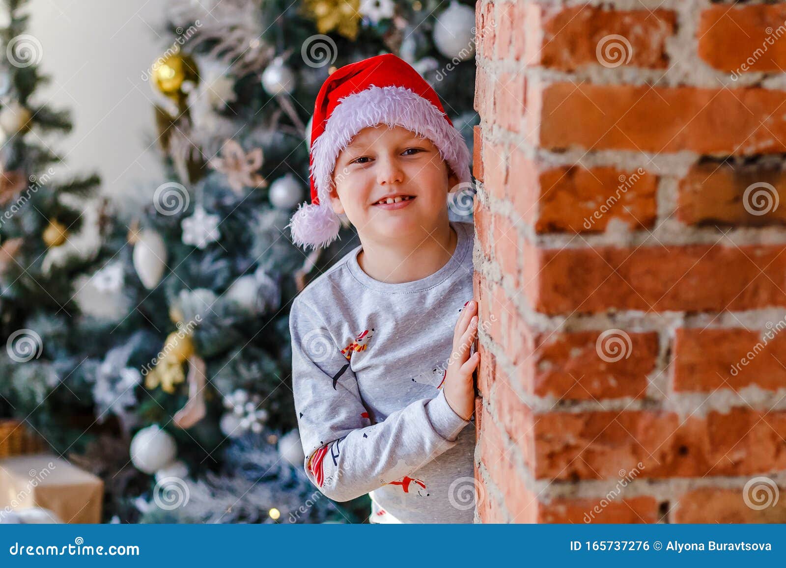 Smiling boy in red cap stock photo. Image of happiness - 165737276