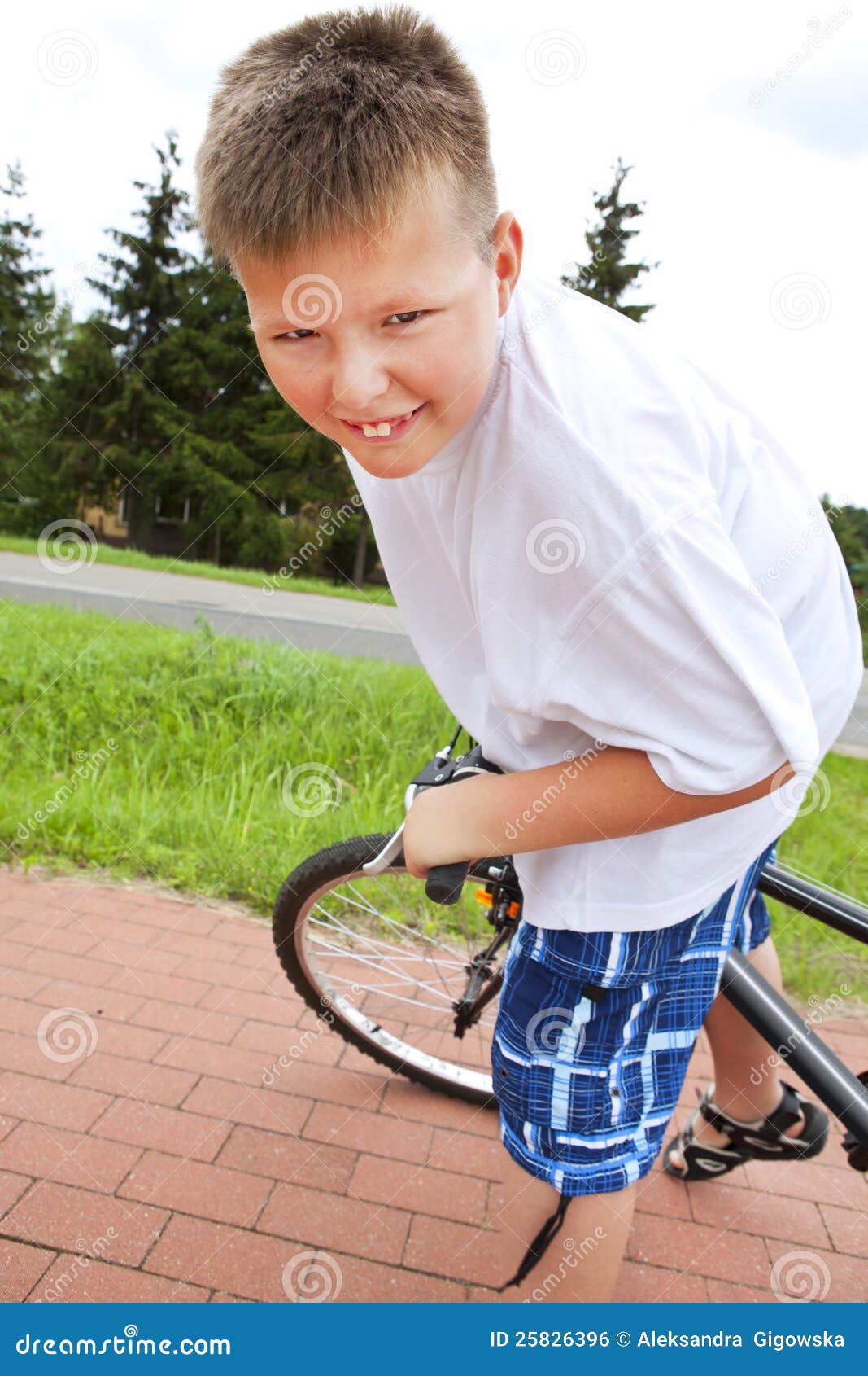 Smiling boy riding bike stock photo. Image of person - 25826396