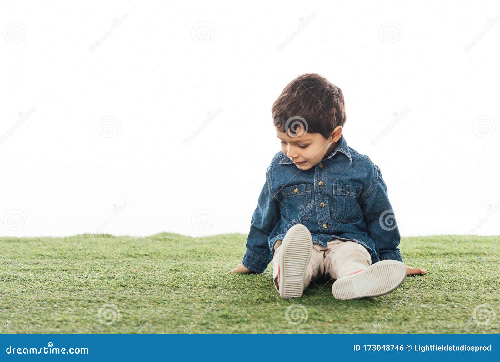 Smiling Boy Sitting on Grass Isolated Stock Photo - Image of happy ...