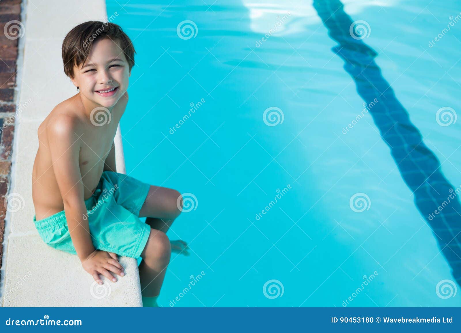 Smiling Boy Sitting at Poolside Stock Photo - Image of child, cheerful ...