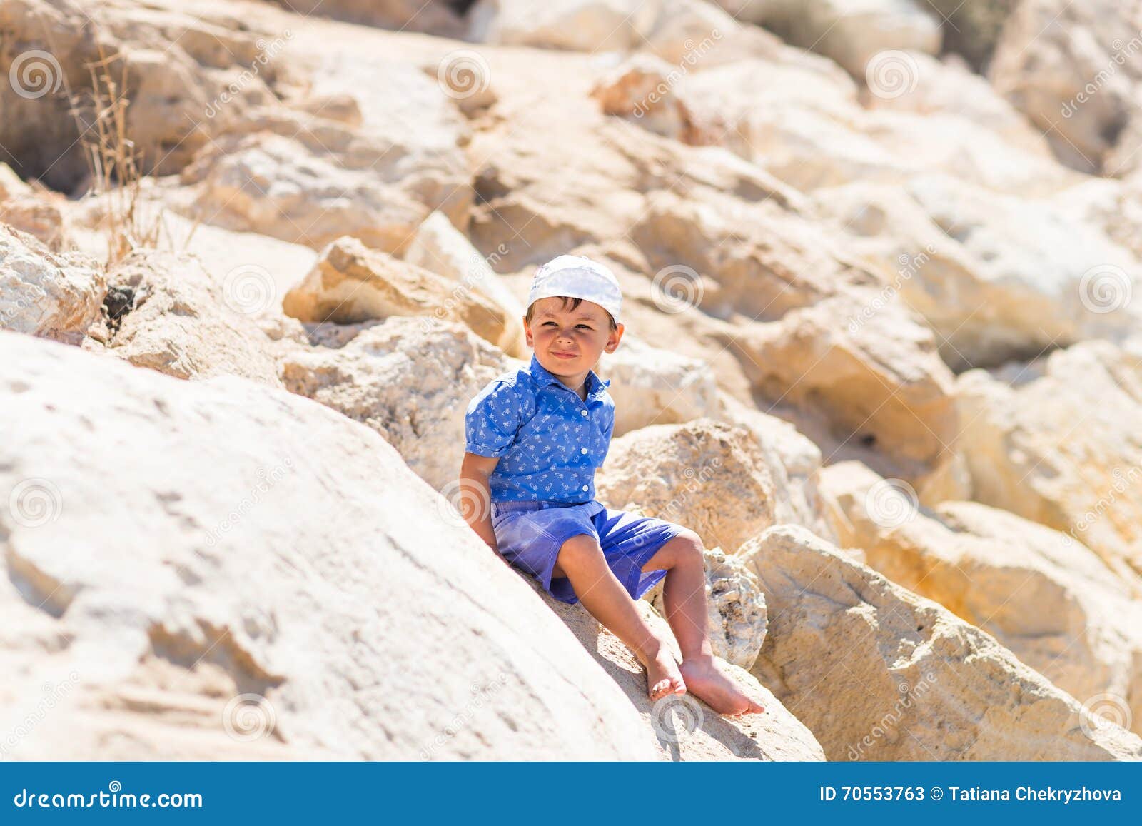 Smiling Boy Sitting on the Rock. Stock Image - Image of expression ...