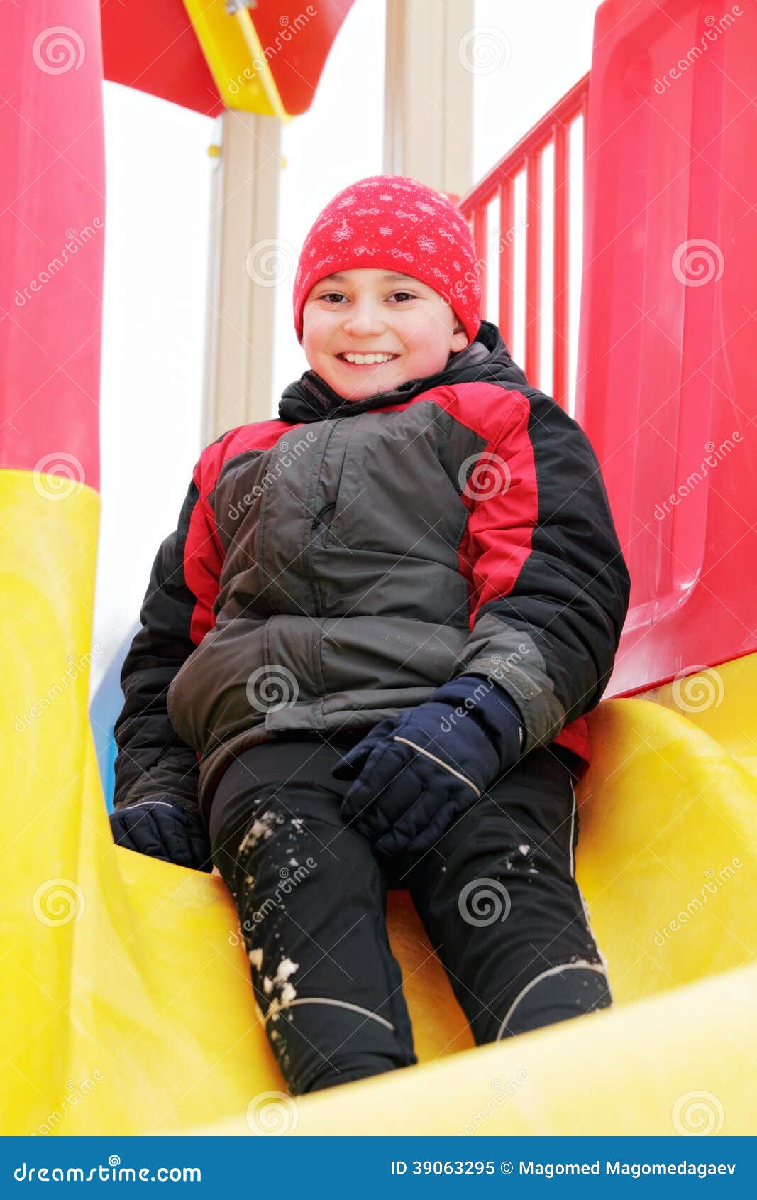 Smiling boy in slide stock image. Image of playground - 39063295