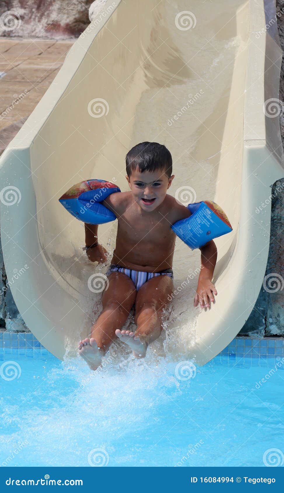 Smiling Boy Slides a Waterslide Stock Photo - Image of fleet, pleasure ...