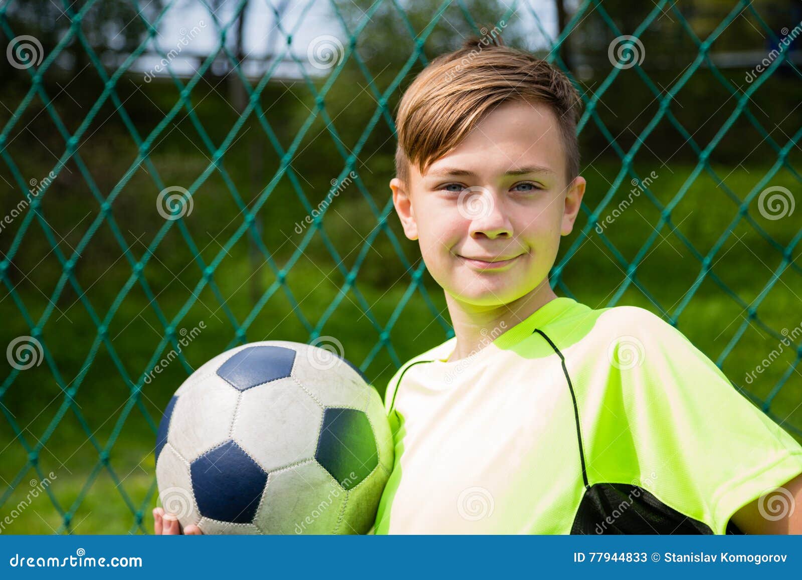 Smiling boy soccer player stock image. Image of sport - 77944833