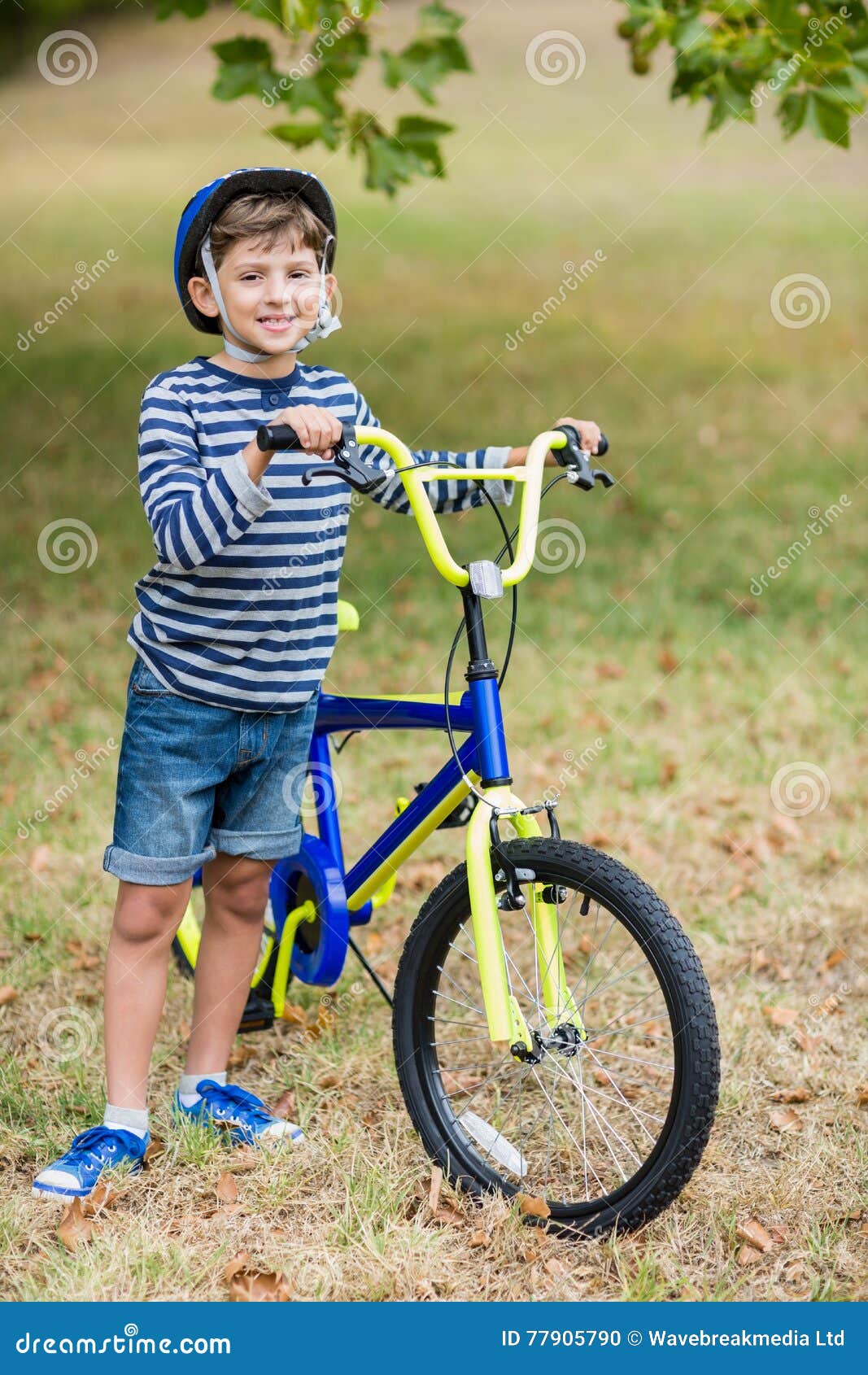 Smiling Boy Standing with Bicycle in Park Stock Photo - Image of ...