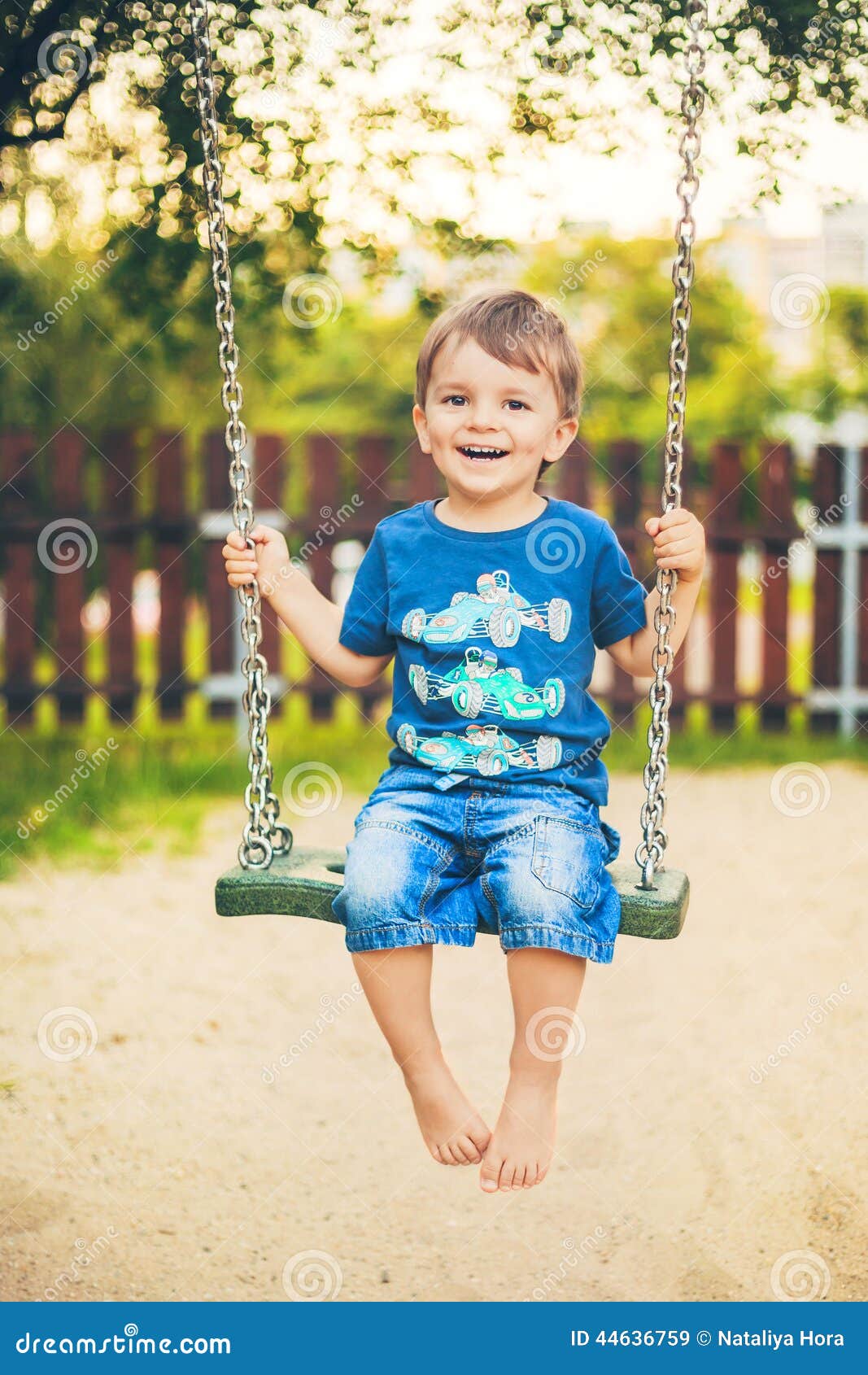Smiling boy on a swing stock image. Image of chain, happy - 44636759