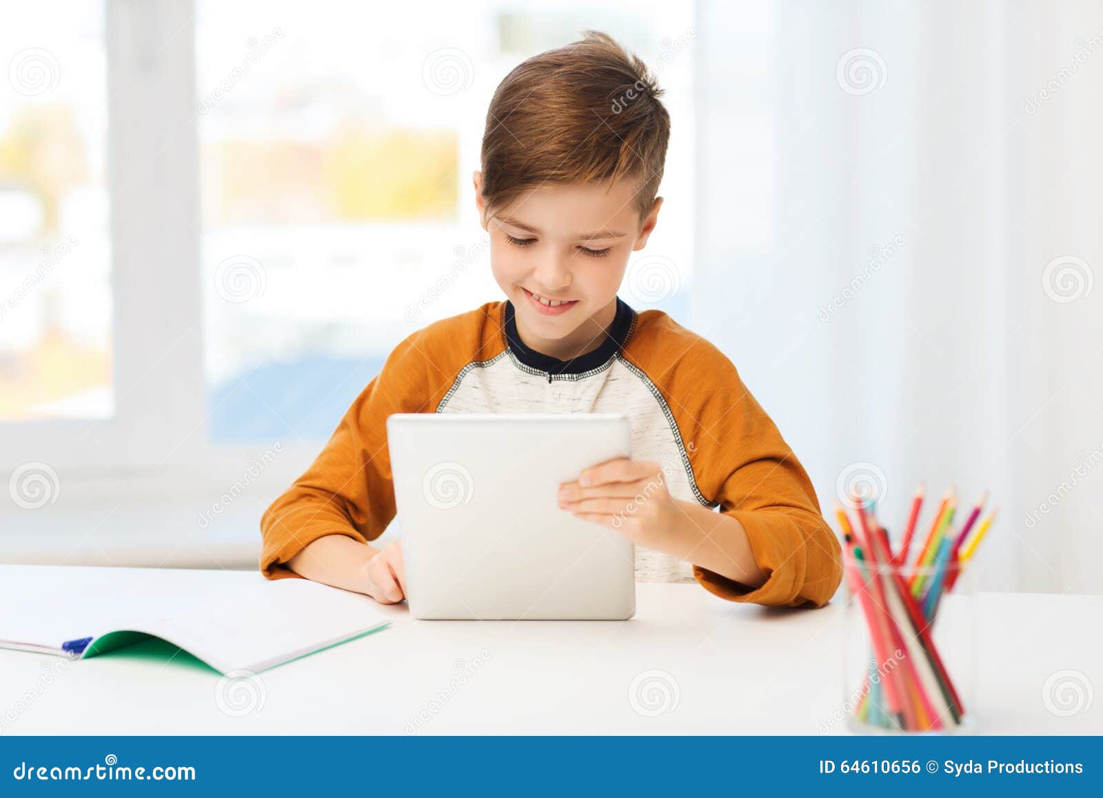 Smiling Boy with Tablet Pc and Notebook at Home Stock Photo - Image of ...