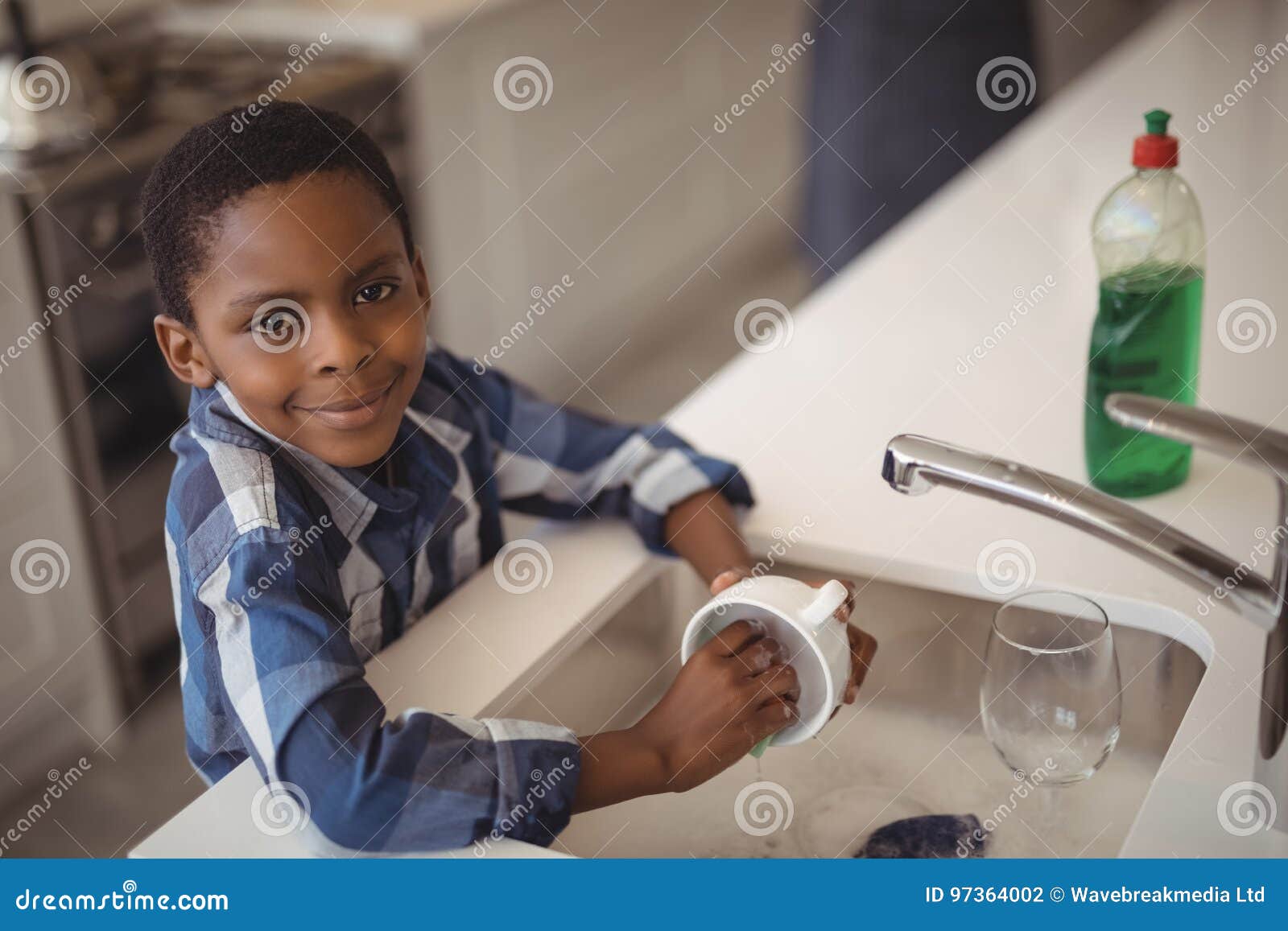 Smiling Boy Washing Cup in Kitchen Sink Stock Photo - Image of ...