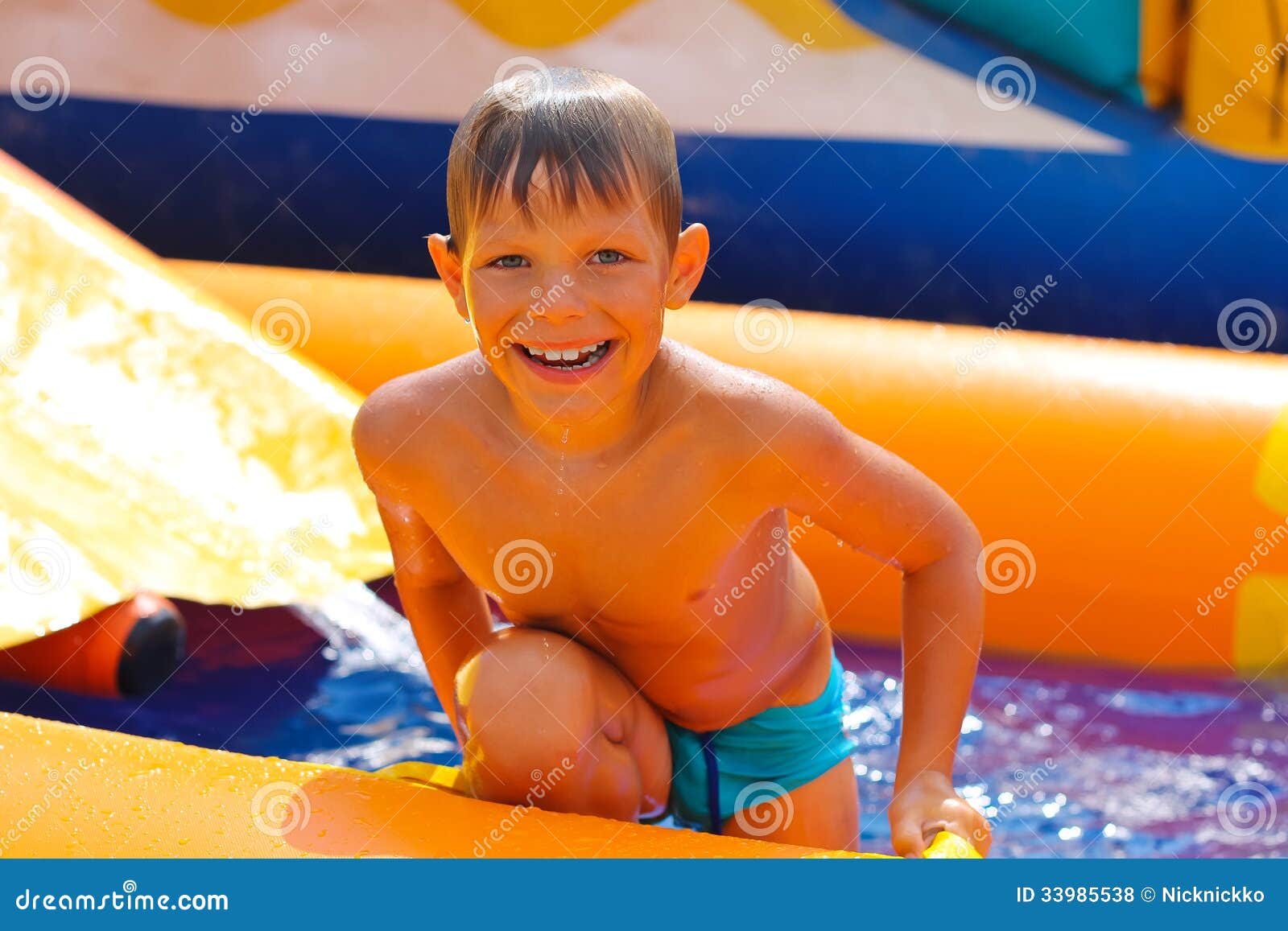 Smiling boy in the water stock photo. Image of splash - 33985538