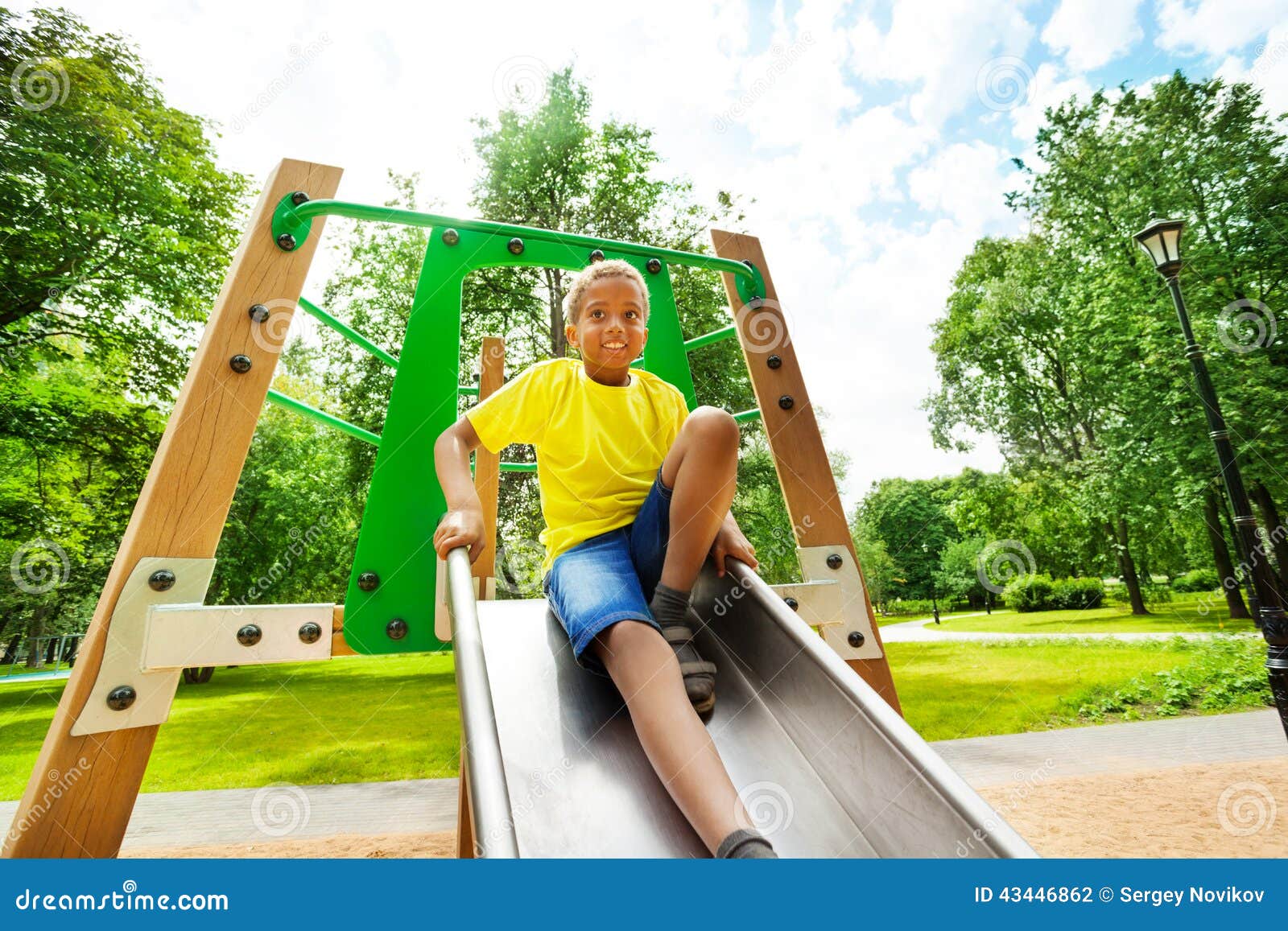 Smiling Boys with Bending Knee on Chute Stock Photo - Image of knee ...