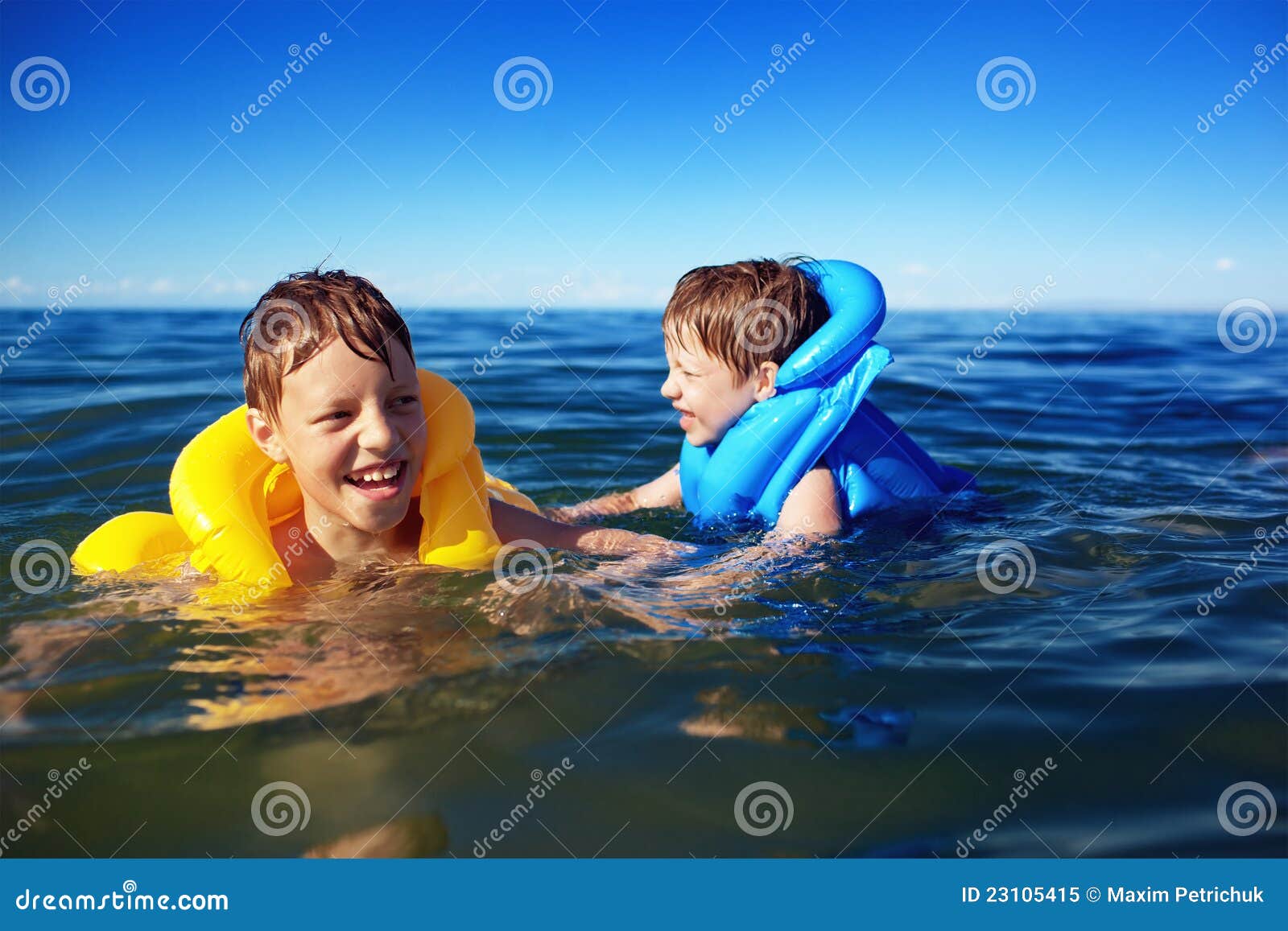 Smiling brothers swimming stock image. Image of sunlight - 23105415