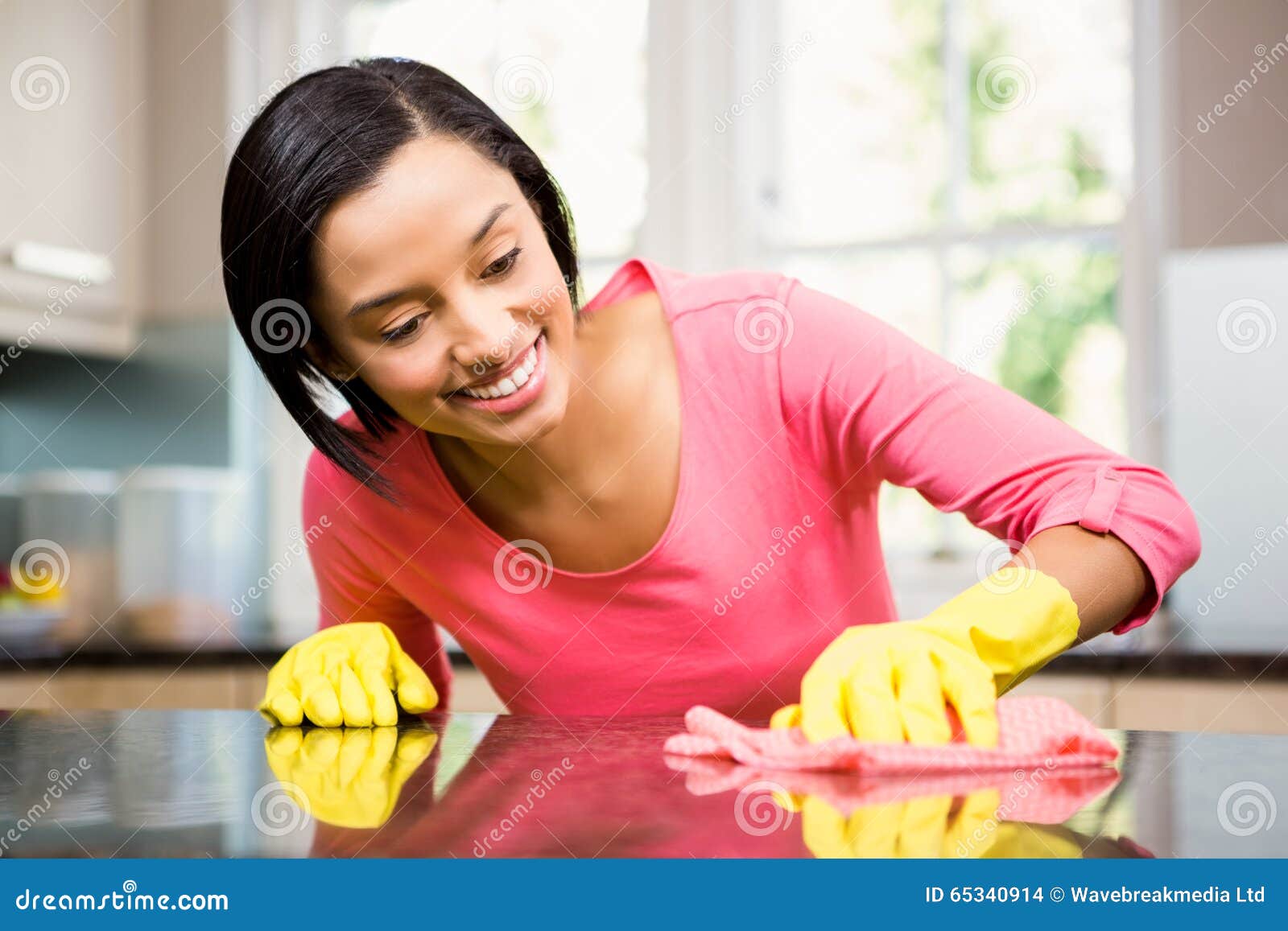 Smiling Brunette Cleaning Kitchen Counter Stock Photo - Image of ...