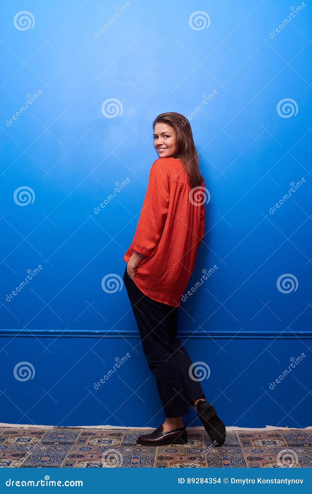 Smiling Brunette Half-turned Posing in the Studio Stock Photo - Image ...