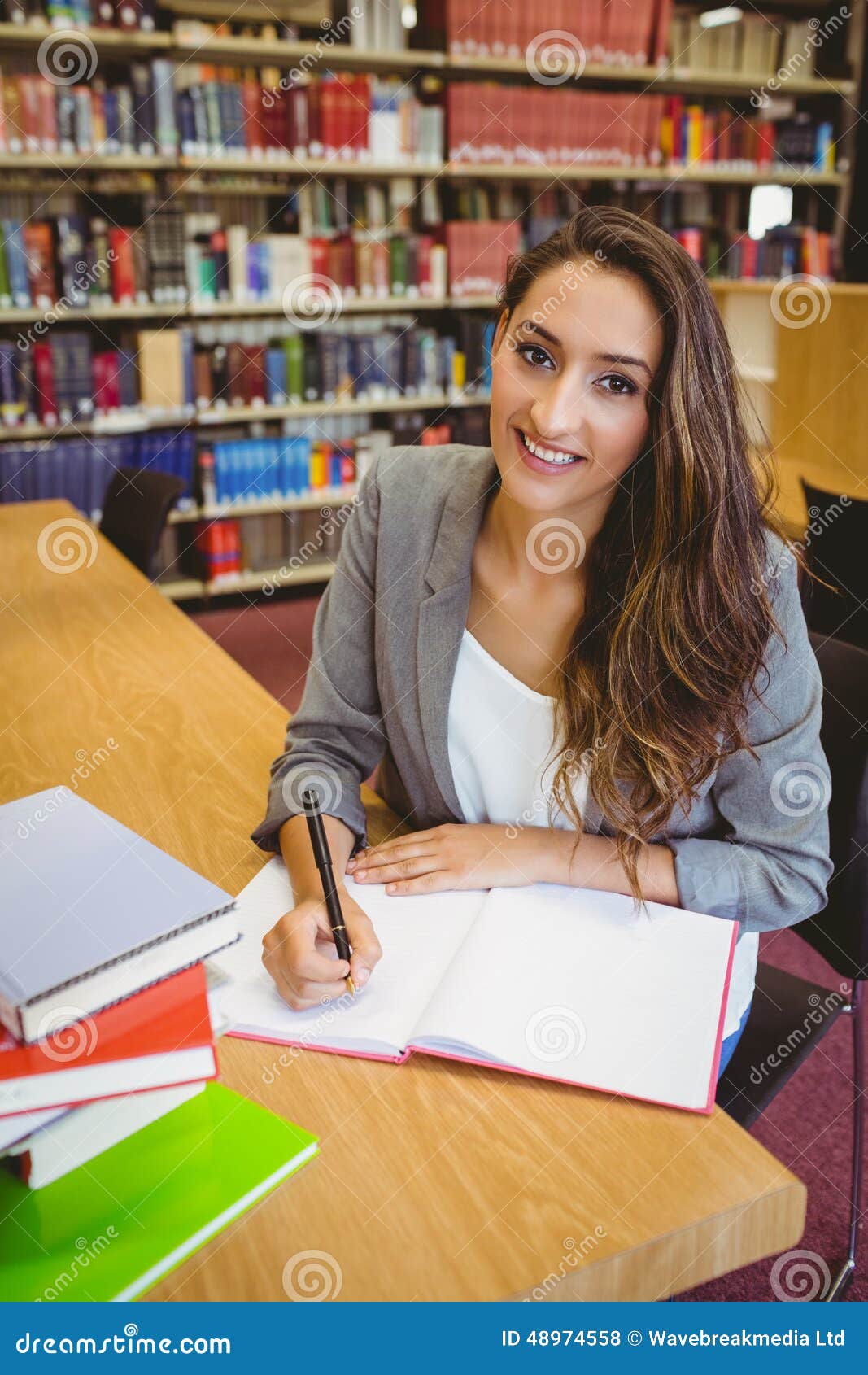 Smiling Brunette Student Doing Her Assignment Stock Photo - Image of ...