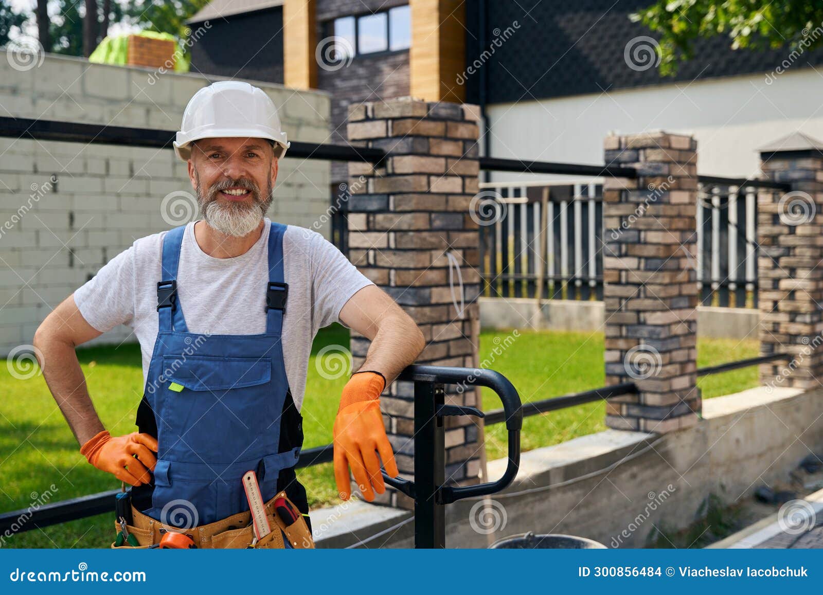 Pleased Construction Worker Posing for Camera at Jobsite Stock Photo ...