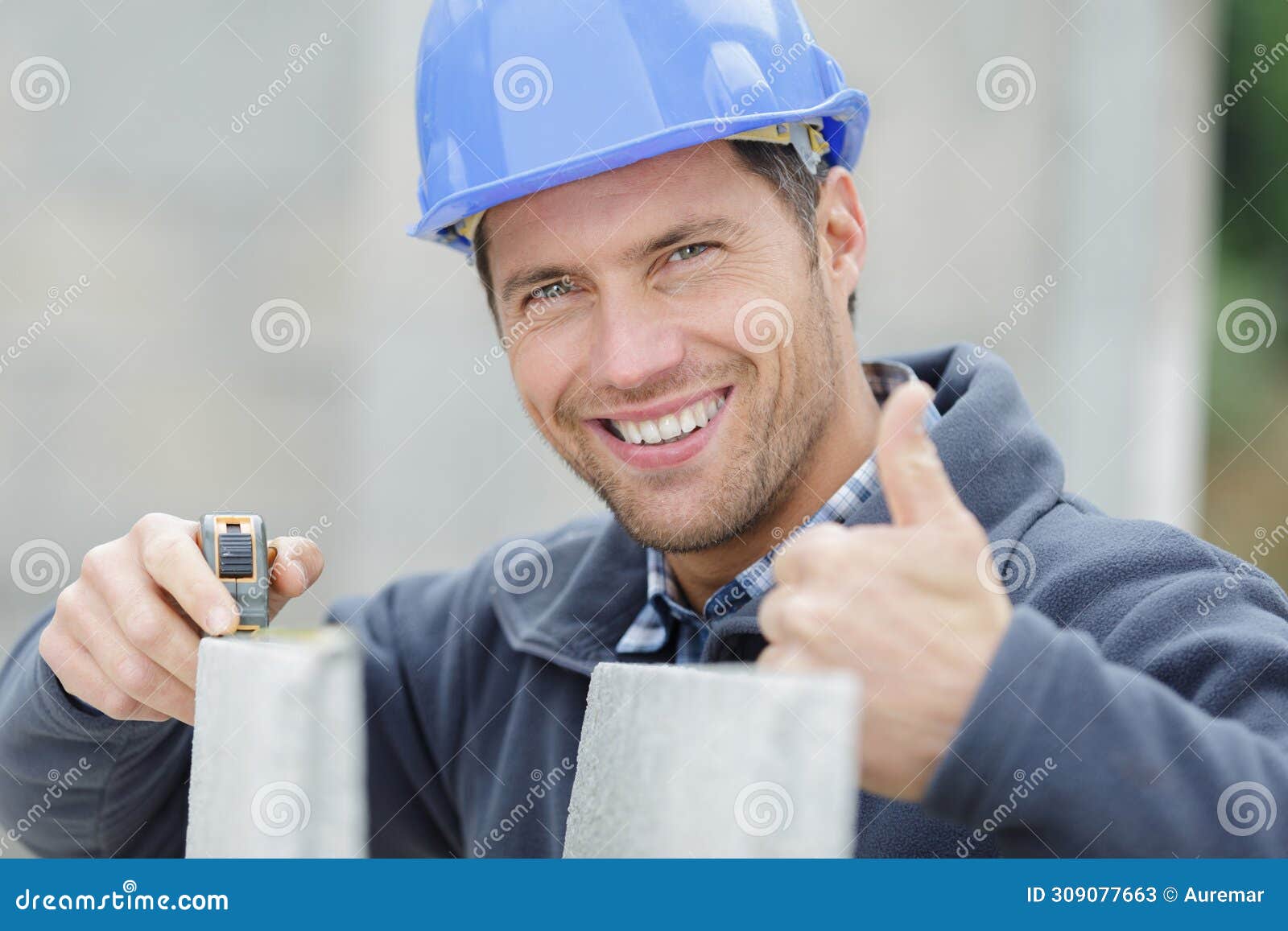 Smiling Builder Worker at Construction Site Showing Thumb Up Stock ...