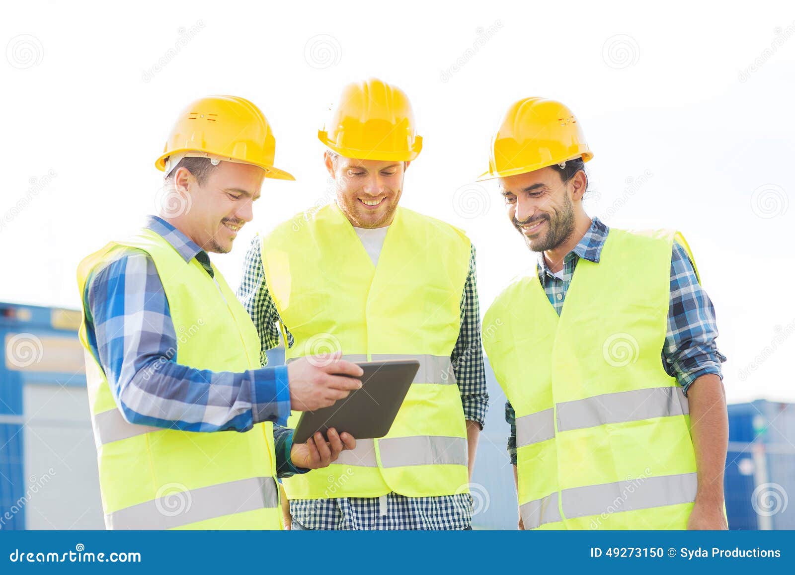 Smiling Builders in Hardhats with Tablet Pc Stock Photo - Image of ...