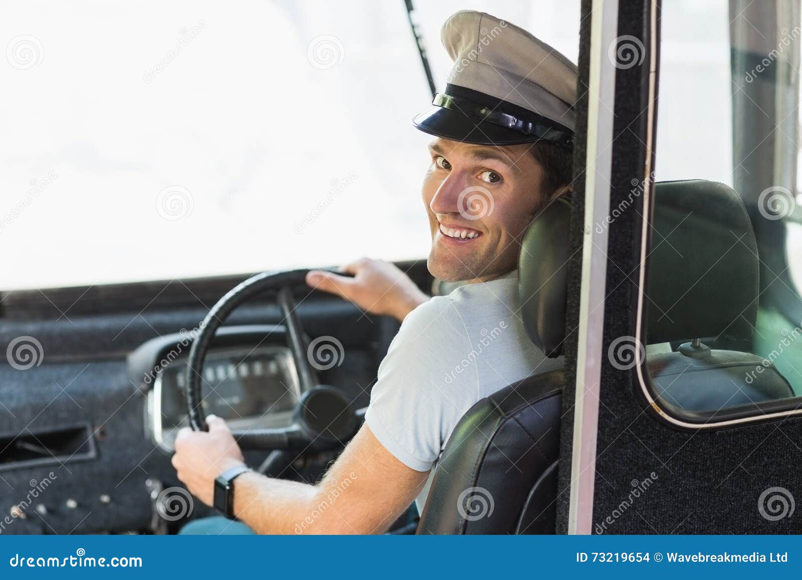 Smiling Bus Driver Driving a Bus Stock Photo - Image of male, looking ...