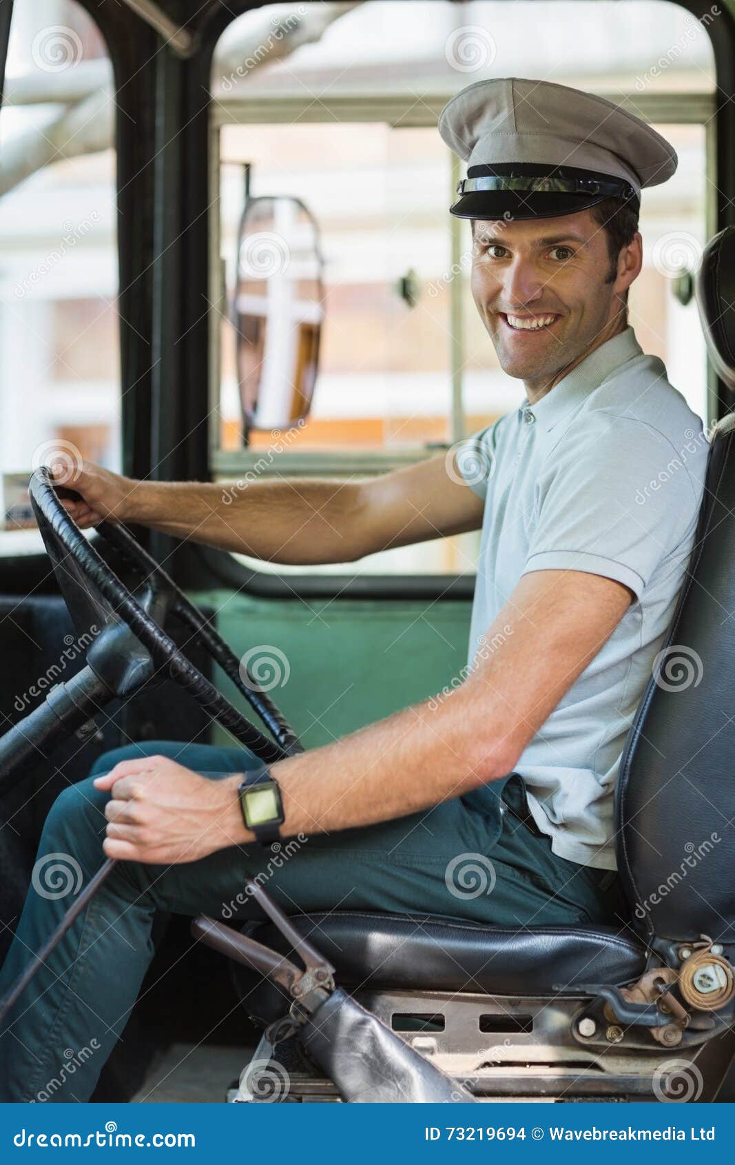 Smiling Bus Driver Driving a Bus Stock Photo - Image of control ...