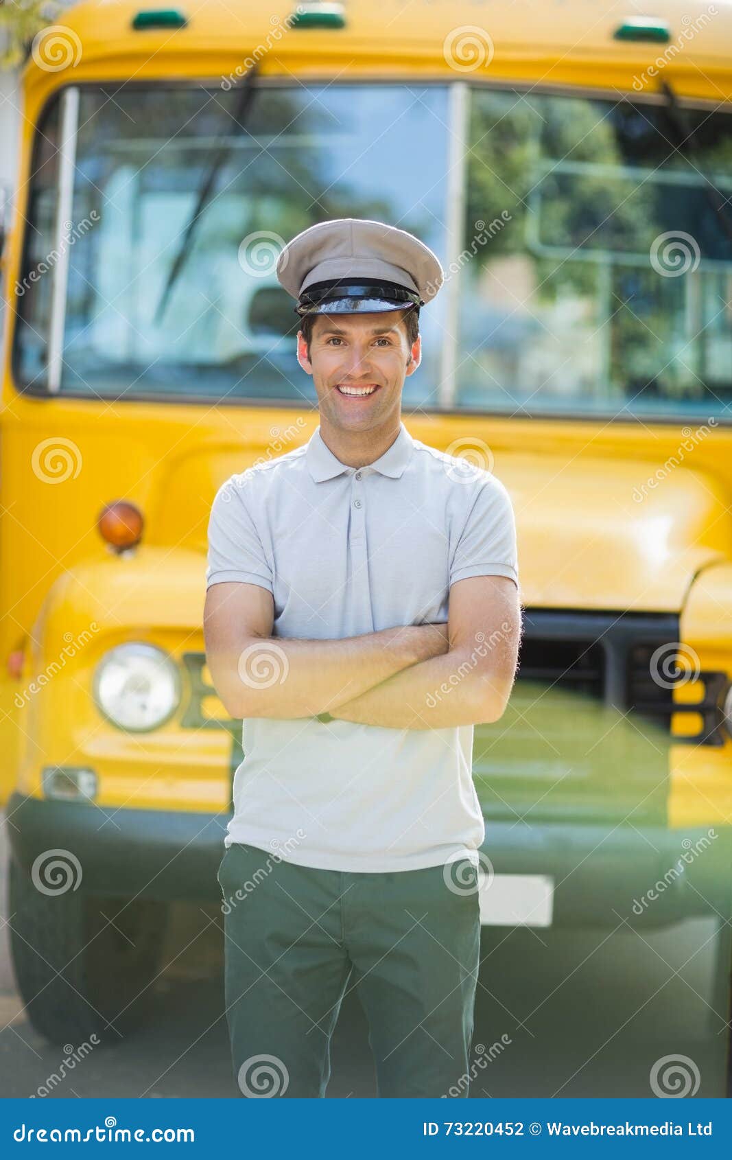 Smiling Bus Driver Standing with Arms Crossed in Front of Bus Stock ...