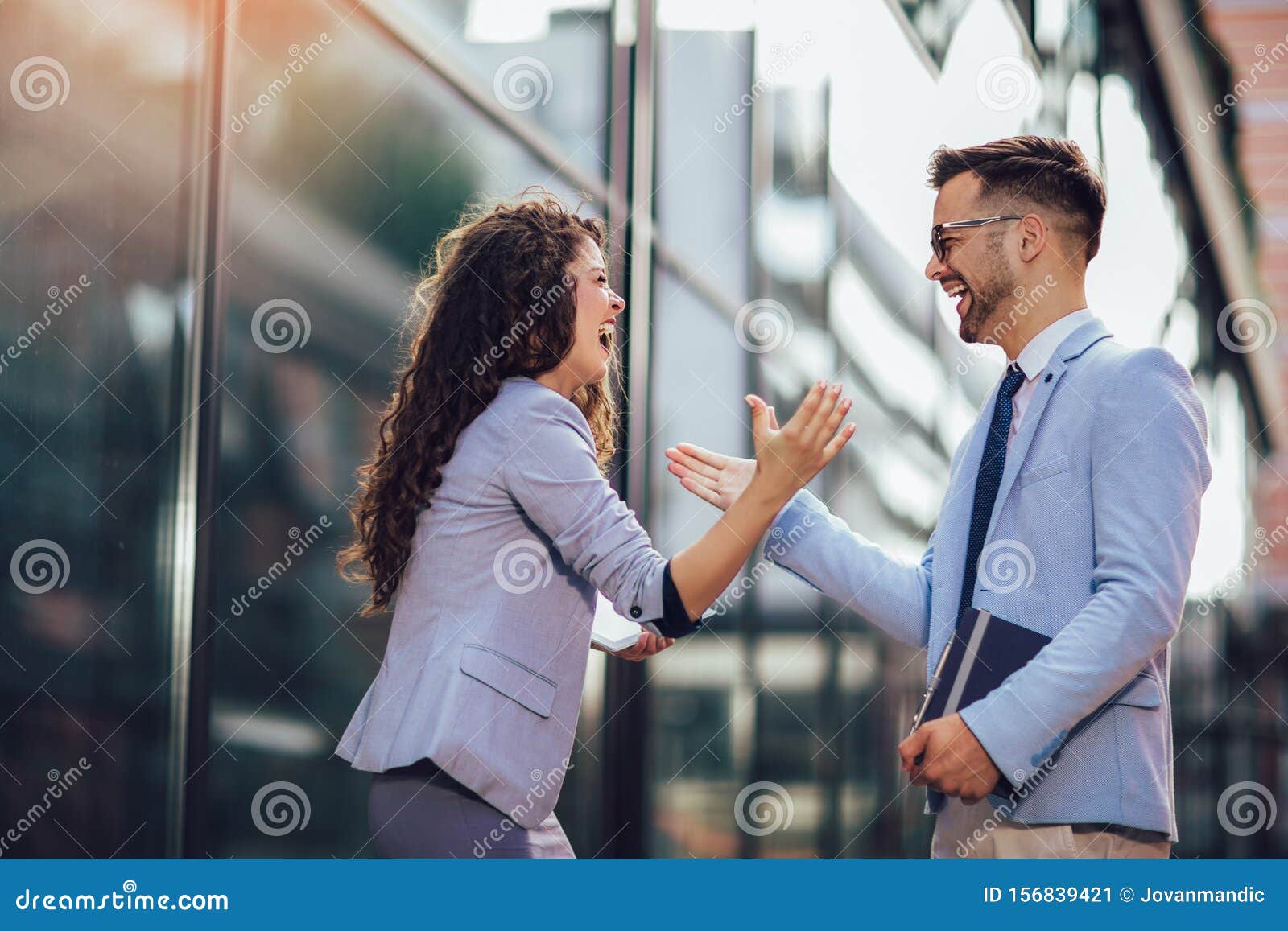 Business Colleagues Greeting Each Other Outdoors Stock Image - Image of ...