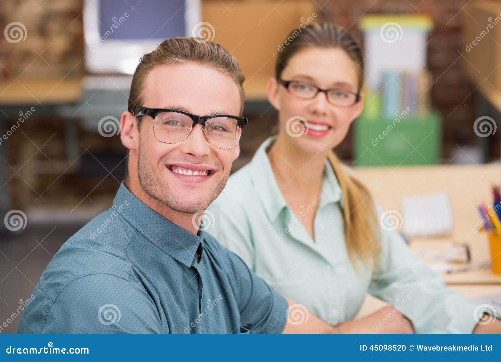 Smiling Business Colleagues in Office Stock Photo - Image of foreground ... Smiling Business Colleagues in Office Stock Photo - Image of foreground ...