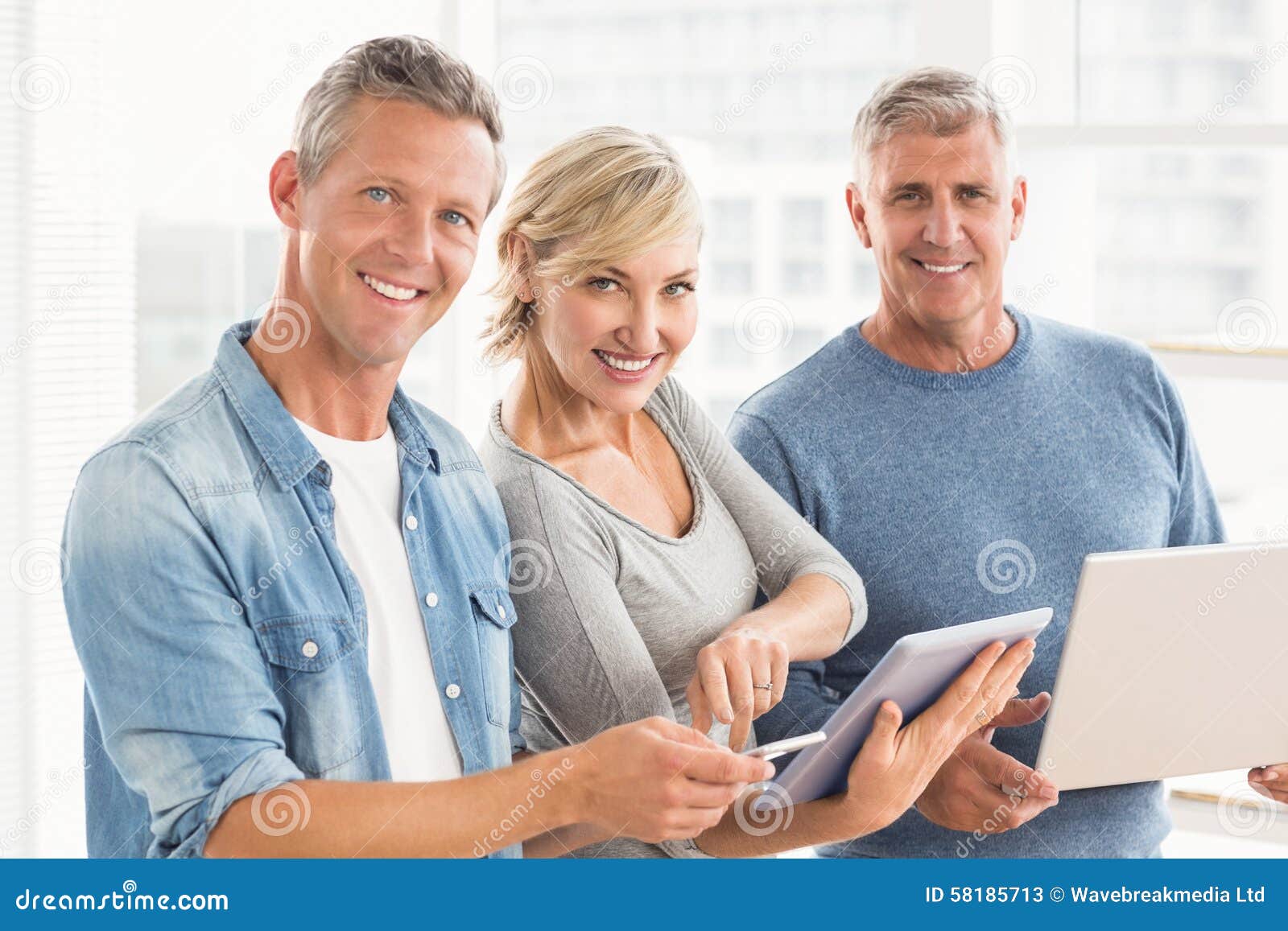 Smiling Business Colleagues Using Electronic Devices Stock Image ... Smiling Business Colleagues Using Electronic Devices Stock Image ...