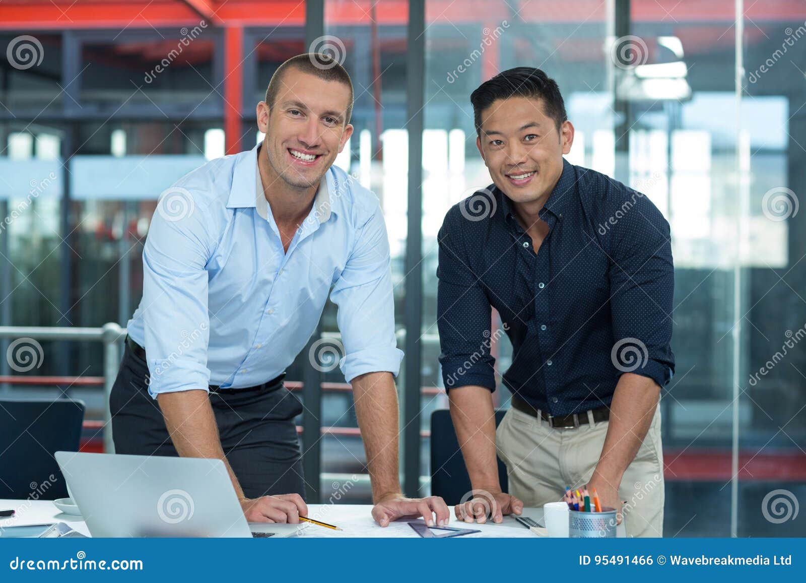 Smiling Business Executives Working in Office Stock Photo - Image of ...